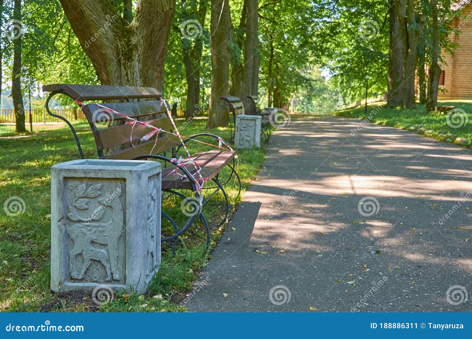 A Bench with a Red and White Ribbon in a Deserted Park Stock Image ...