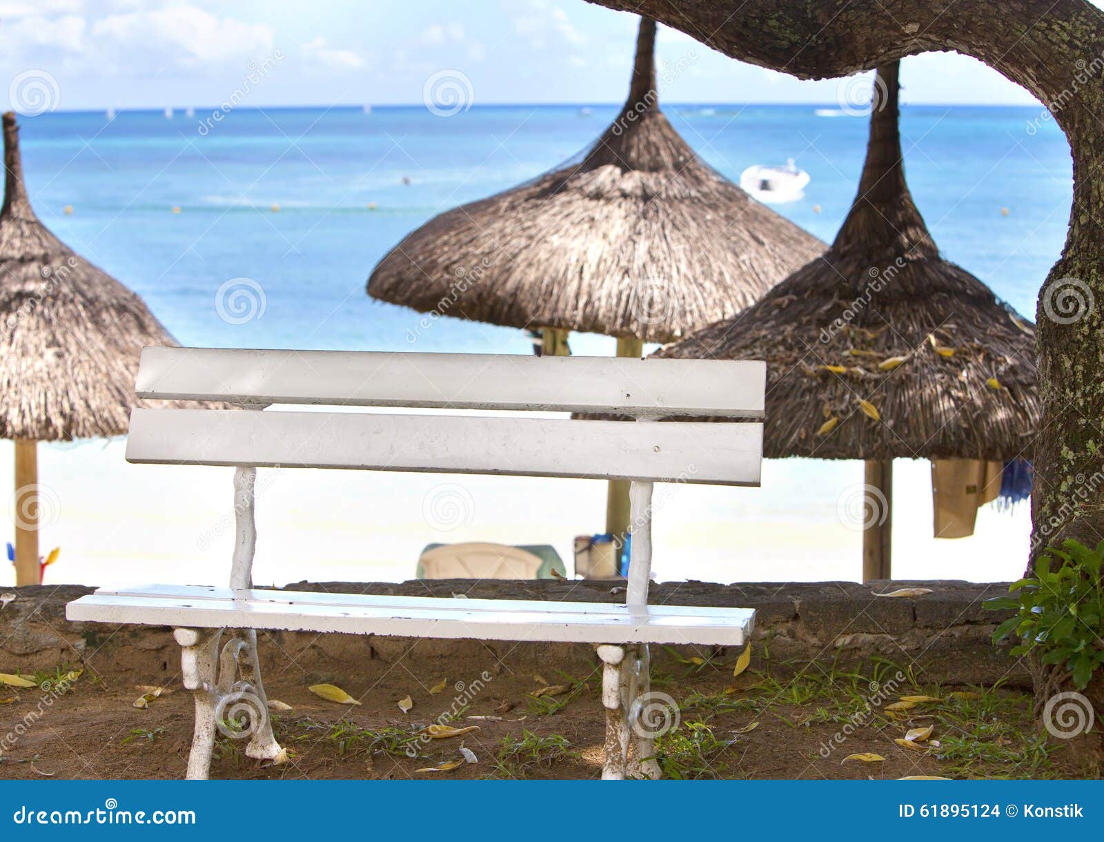 Bench for Rest Under a Straw Sunshade on the Seashore. Mauritius Stock ...