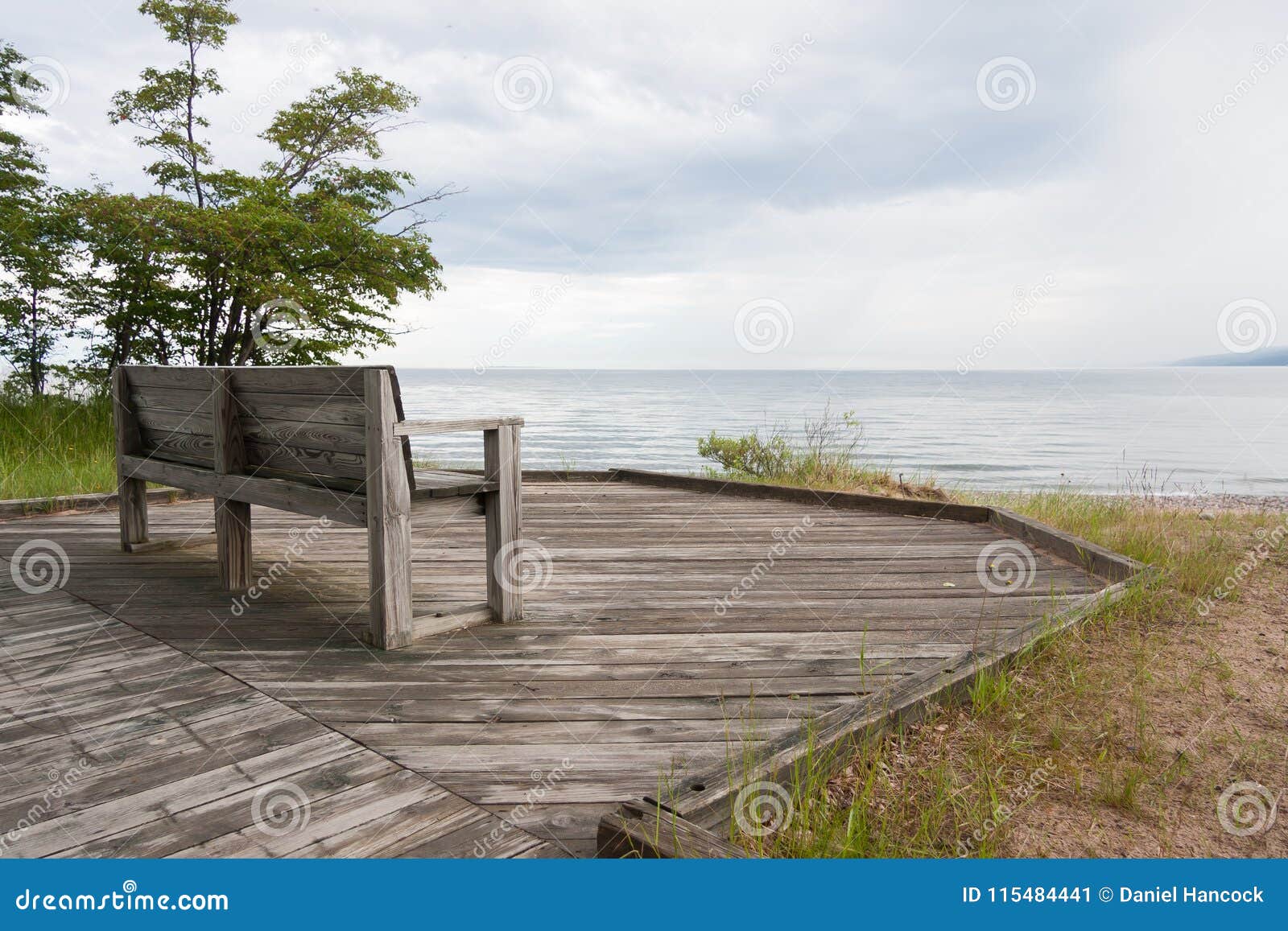 Bench on Shoreline with Clouds Stock Image - Image of coast, platform ...
