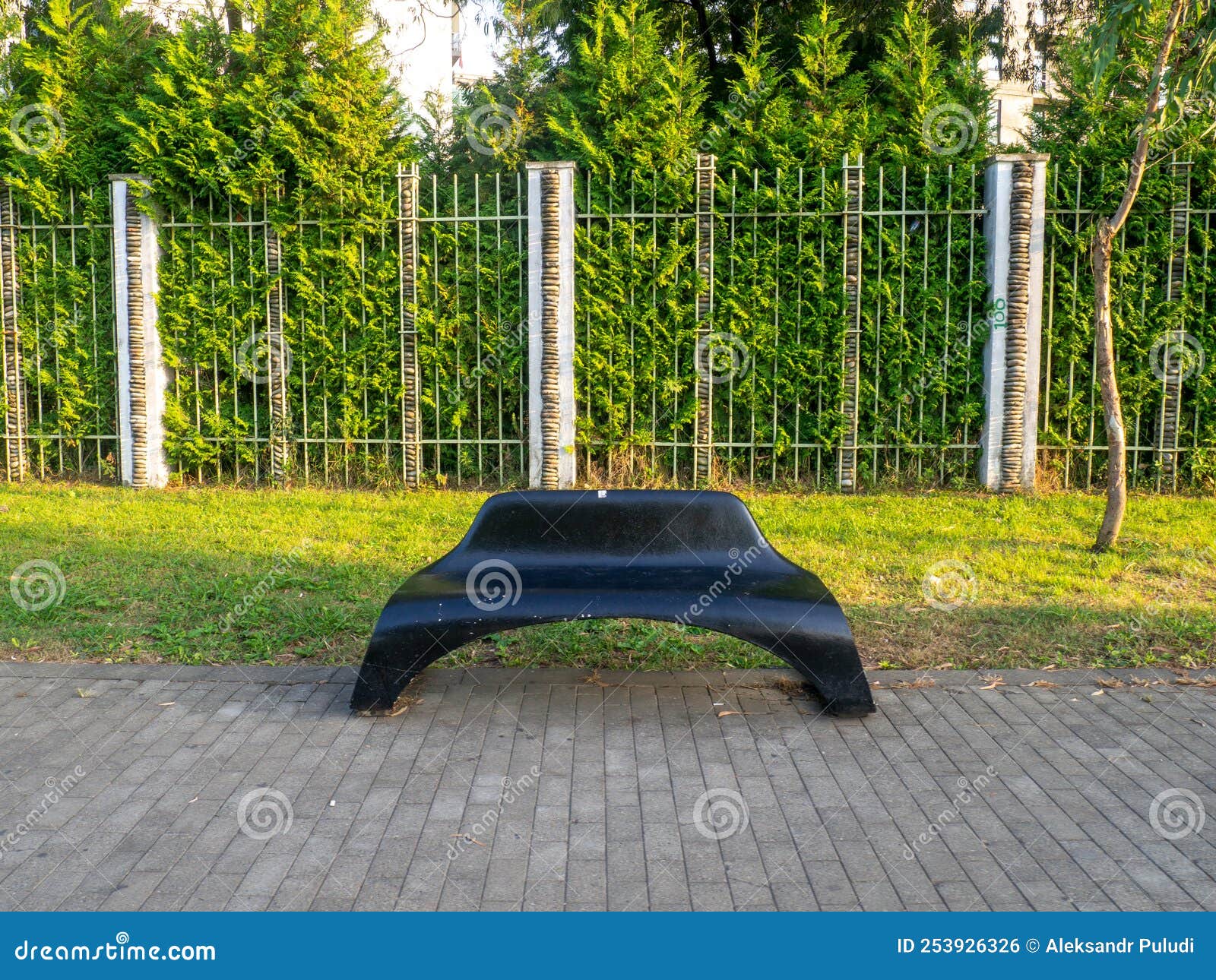 Bench of an Unusual Shape in the Park. Seat Design Stock Photo - Image ...