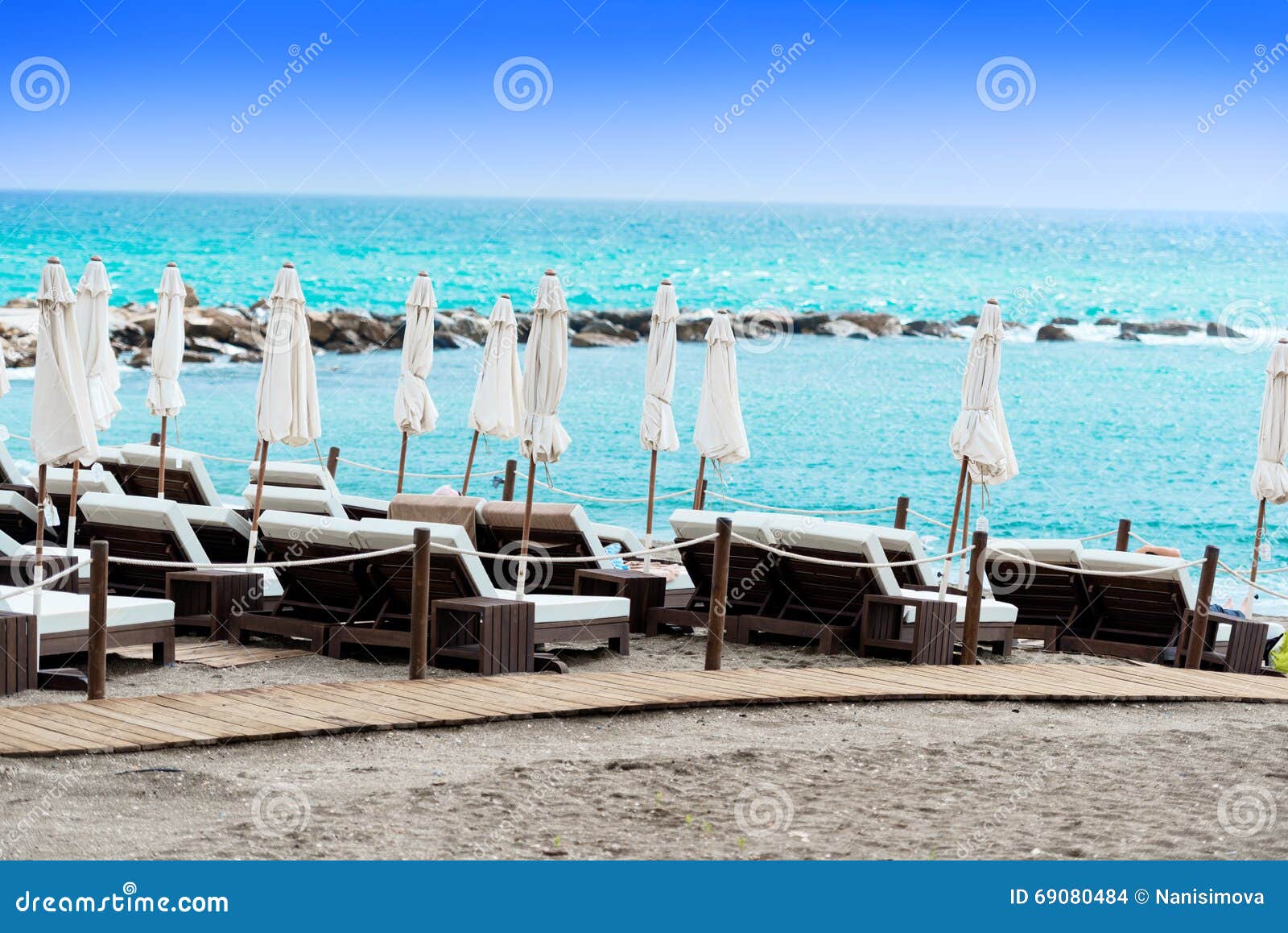 Benches at luxury hotel stock photo. Image of deck, sunbeds - 69080484