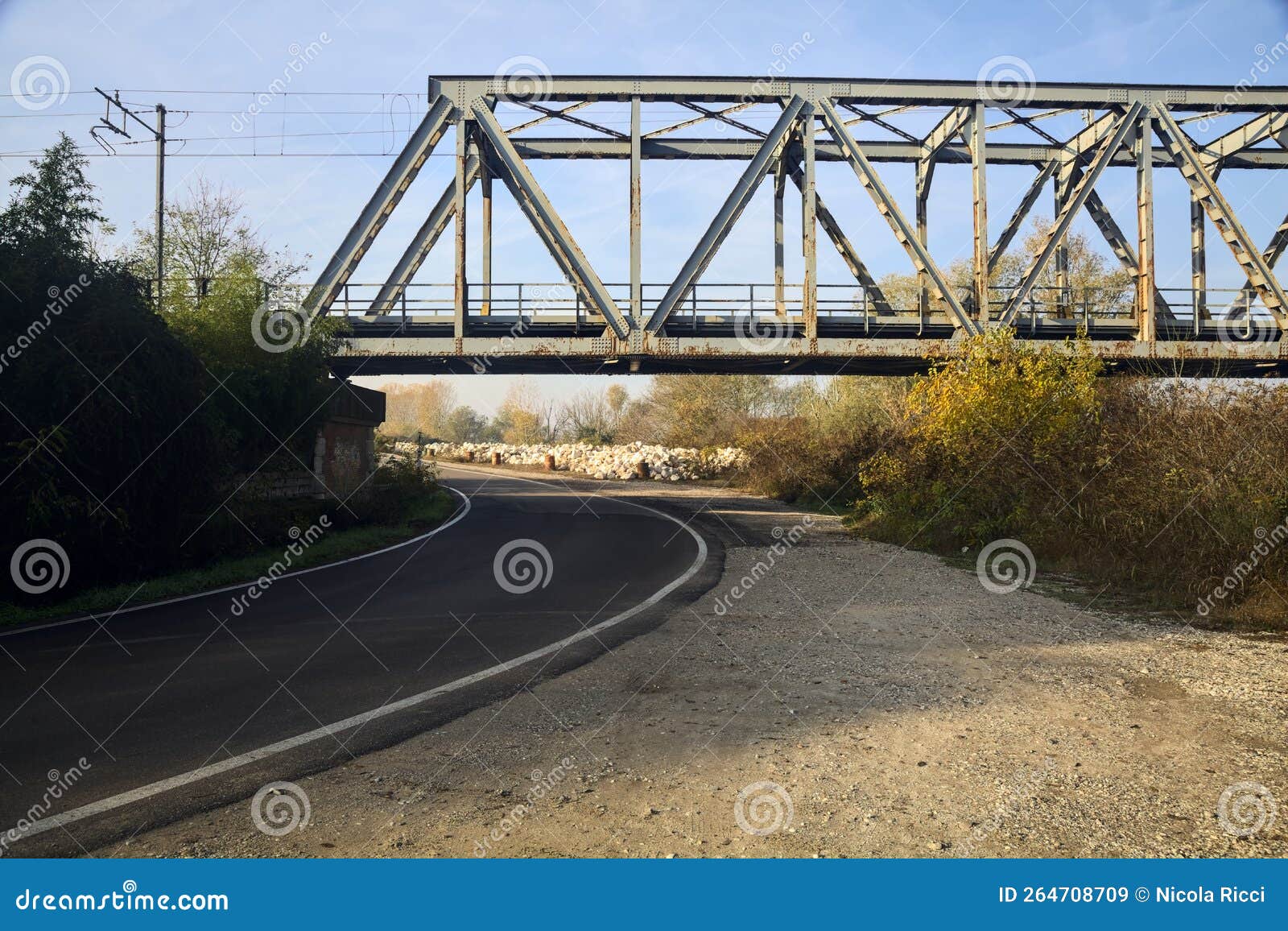 Bend in a Country Road Under a Railroad Bridge Stock Image - Image of ...