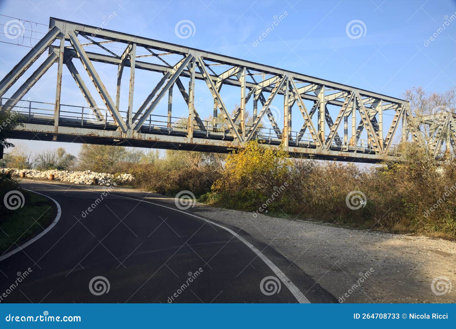 Bend in a Country Road Under a Railroad Bridge Stock Image - Image of ...