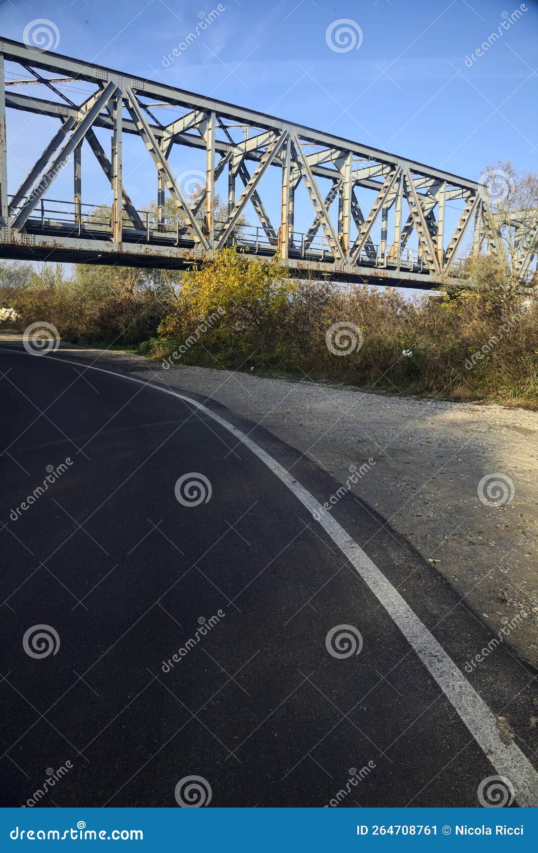 Bend in a Country Road Under a Railroad Bridge Stock Image - Image of ...