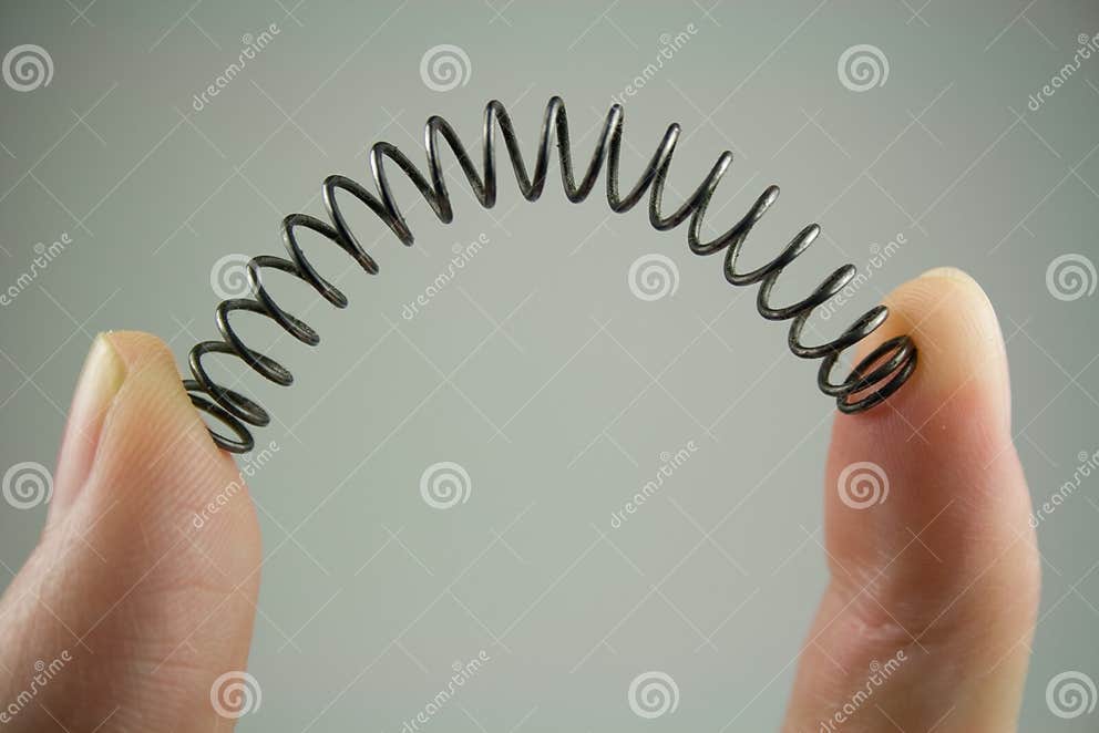 Bending Spring with Fingers Stock Image - Image of compressed, spring ...