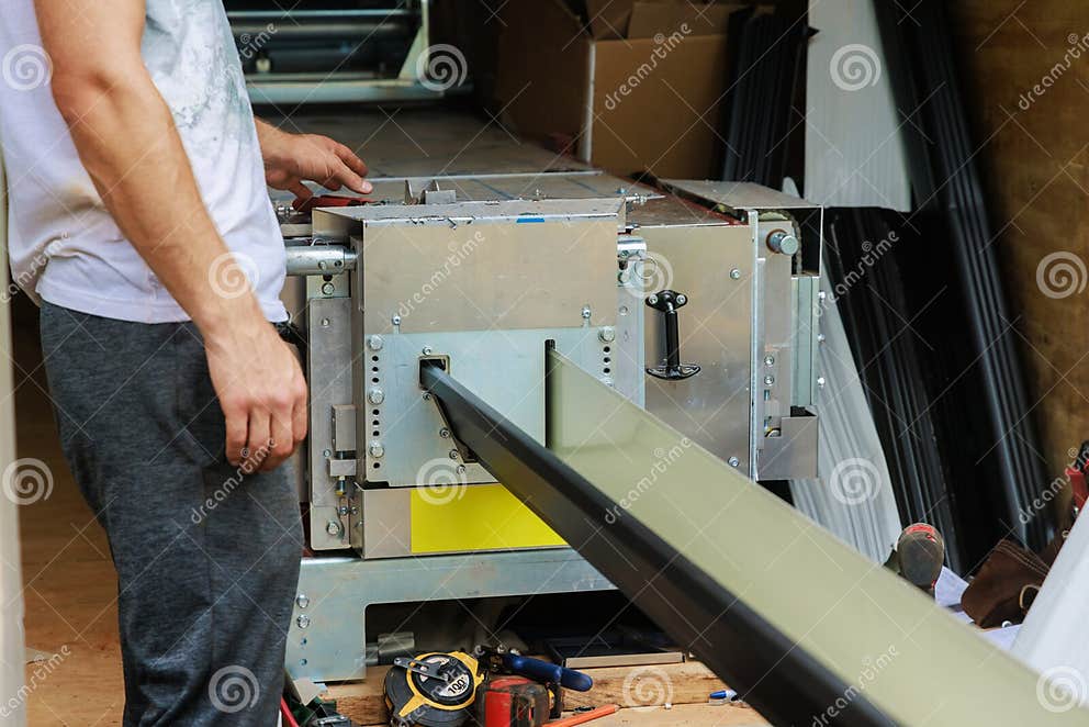 Bending Thin Metal Rain Gutters is Performed with a Bending Machine ...