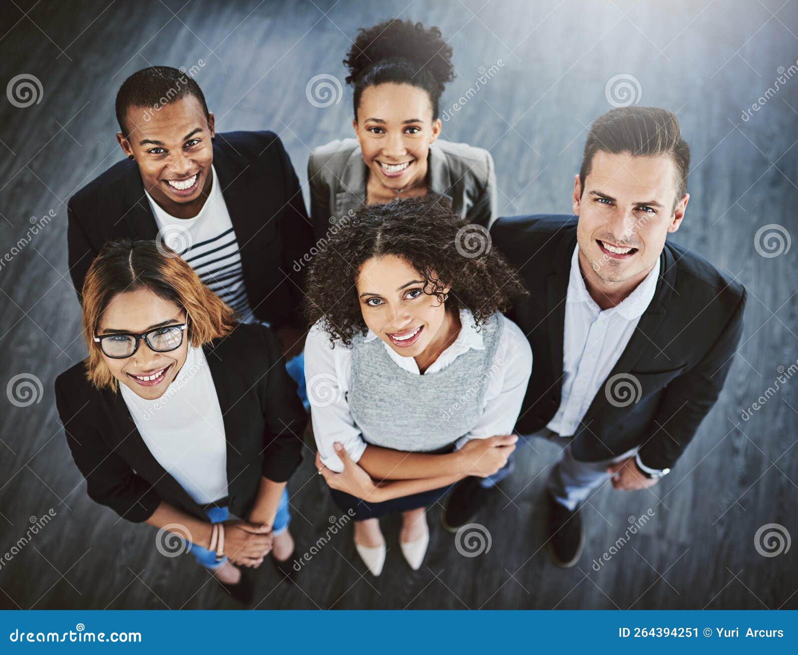 The Benefits of Teamwork are Far Reaching. High Angle Shot of a Group of Businesspeople Standing ...