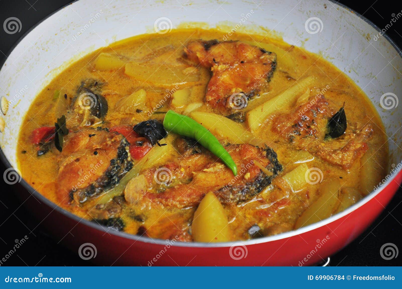 Bengali Fish Curry with Potato and Turmeric Stock Photo - Image of ...