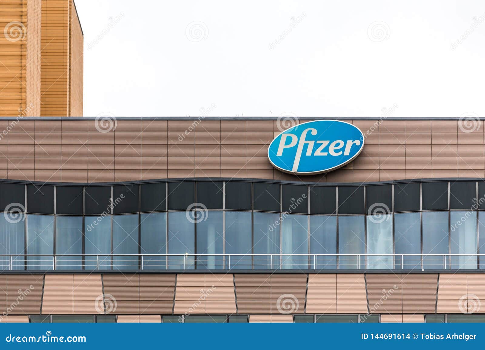 Pfizer Sign, Logo On The Facade Of Pharmaceutical And Biotechnology ...