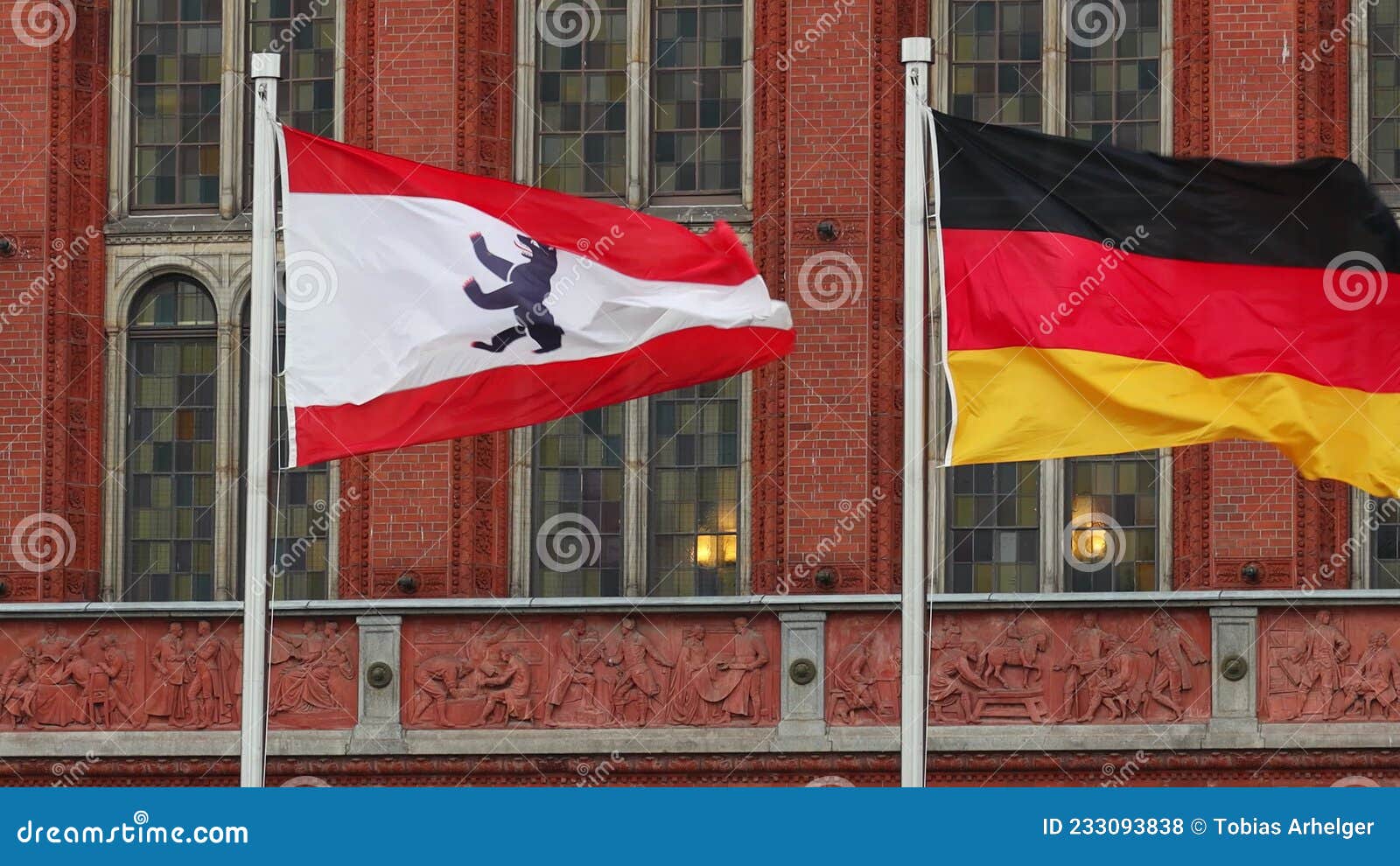 The Flags of Berlin and Germany in the Wind on the Red Berlin Town Hall ...