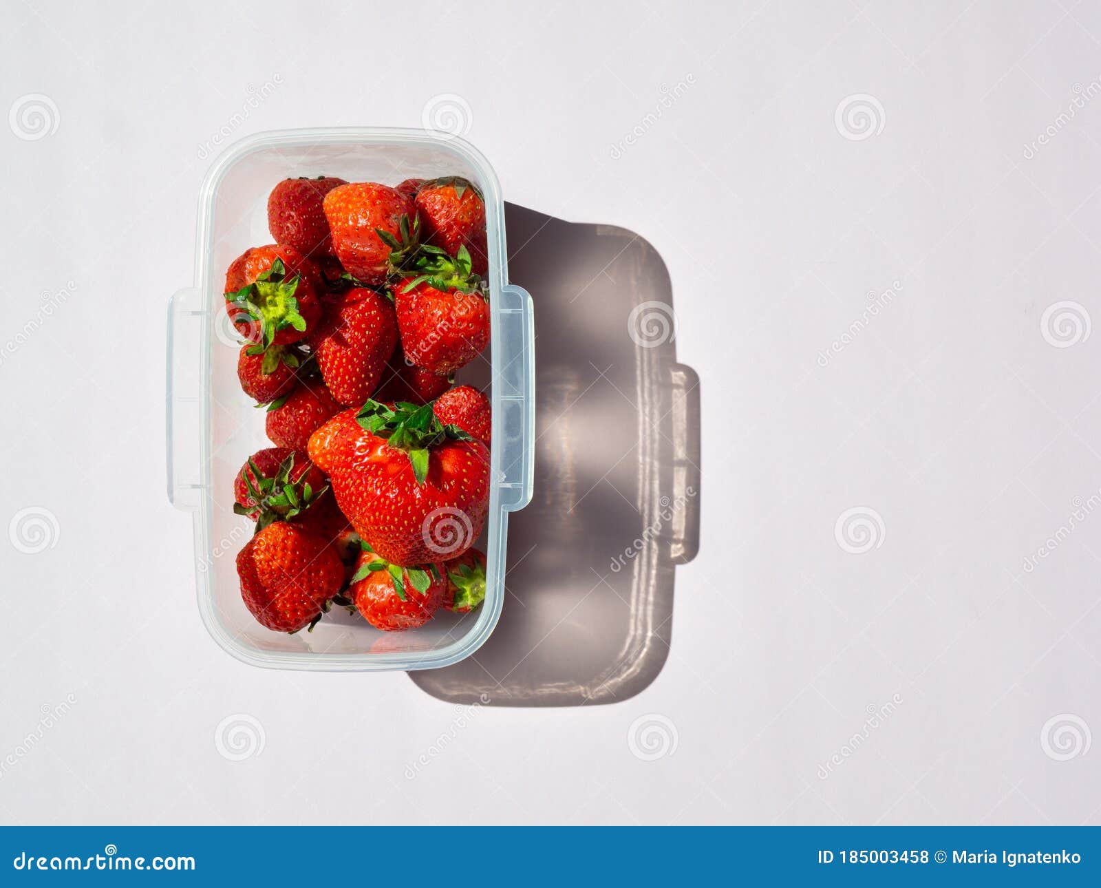 Strawberries in Plastic Container on White Background. Stock Photo ...