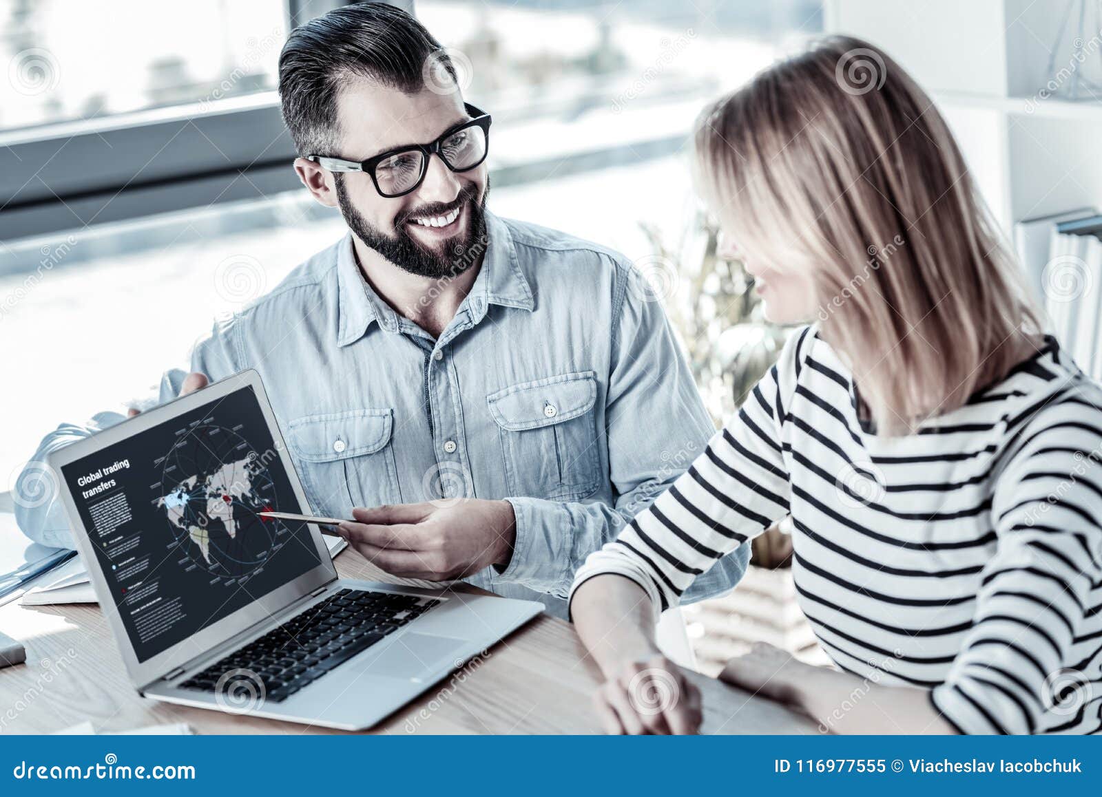Bespectacled Pleasant Man Sitting and Demonstrating Program. Stock ...