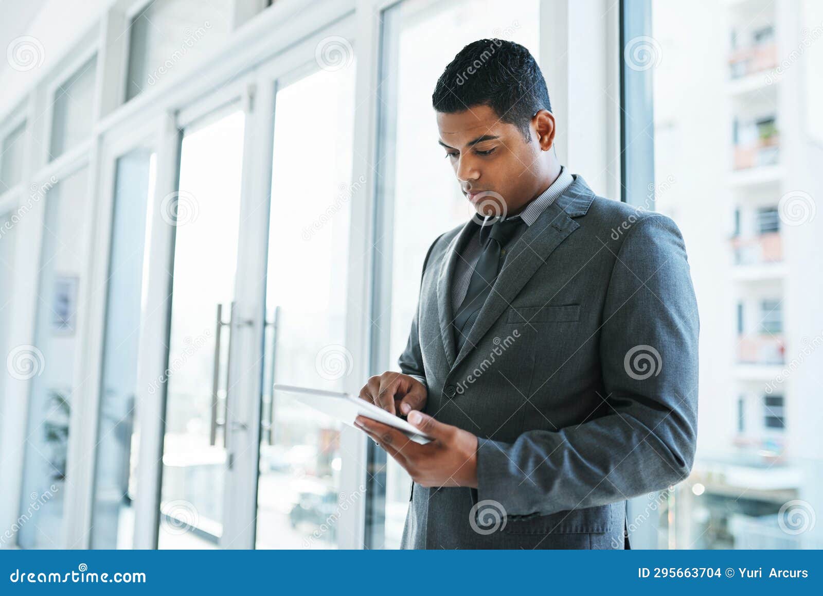 The Best Device To Do My Best Work. Studio Shot Of A Businessman Using ...