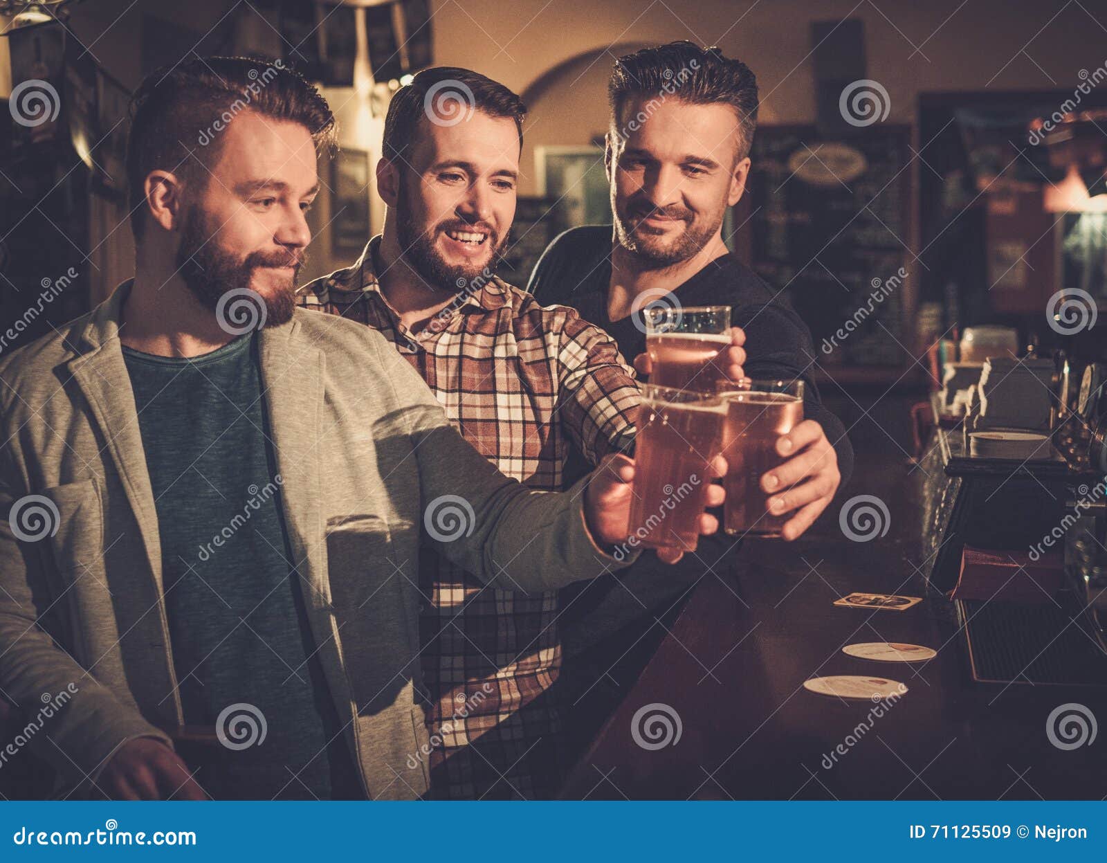 Best Friends Having Fun and Drinking Draft Beer at Bar Counter in Pub ...