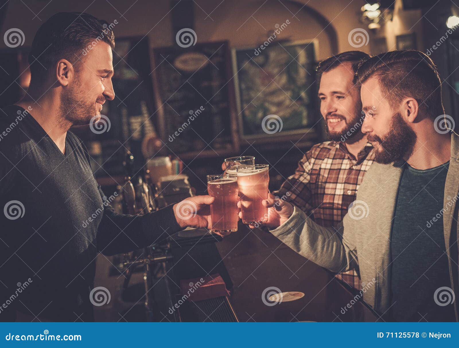 Best Friends Having Fun and Drinking Draft Beer at Bar Counter in Pub ...