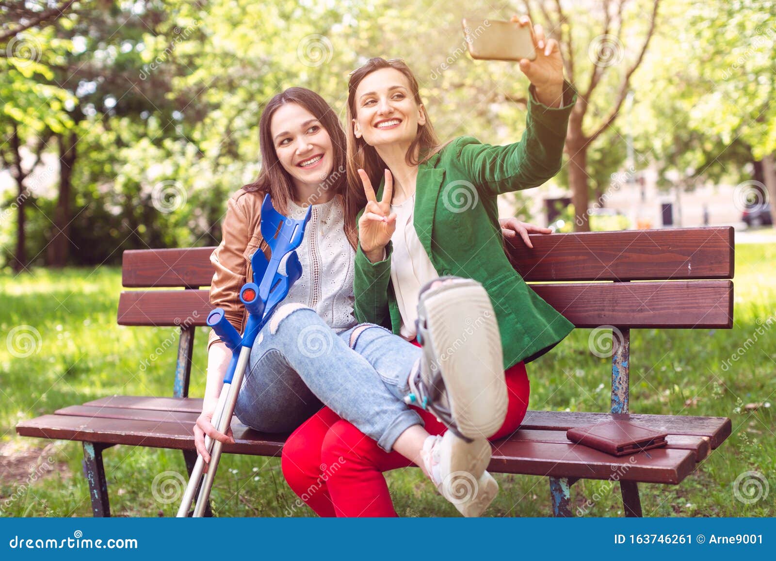 Best Friends with One Having a Broken Leg Taking a Selfie Stock Image ...