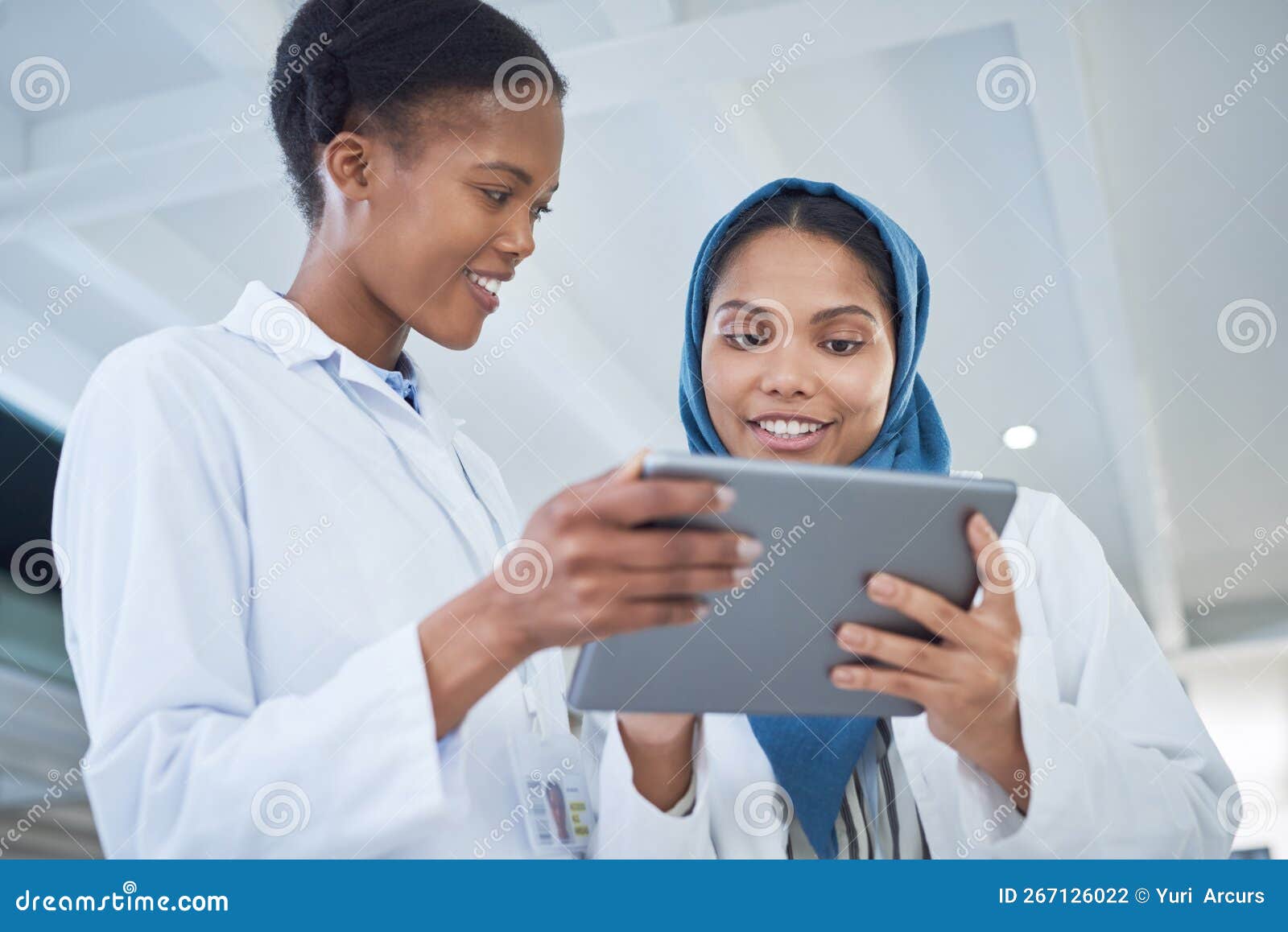 The Best Gadget in a Scientists Toolkit. Two Young Scientists Using a ...