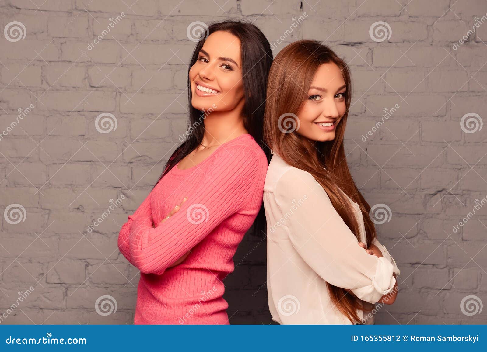 Best Girlfriends Stand Back To Back Crossed Hands and Smiling Stock ...
