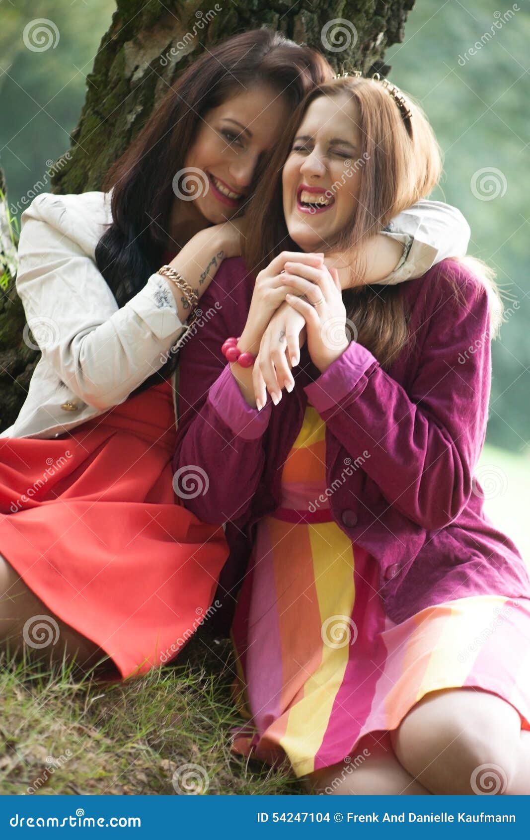 Best girls under a tree stock photo. Image of park, spring - 54247104