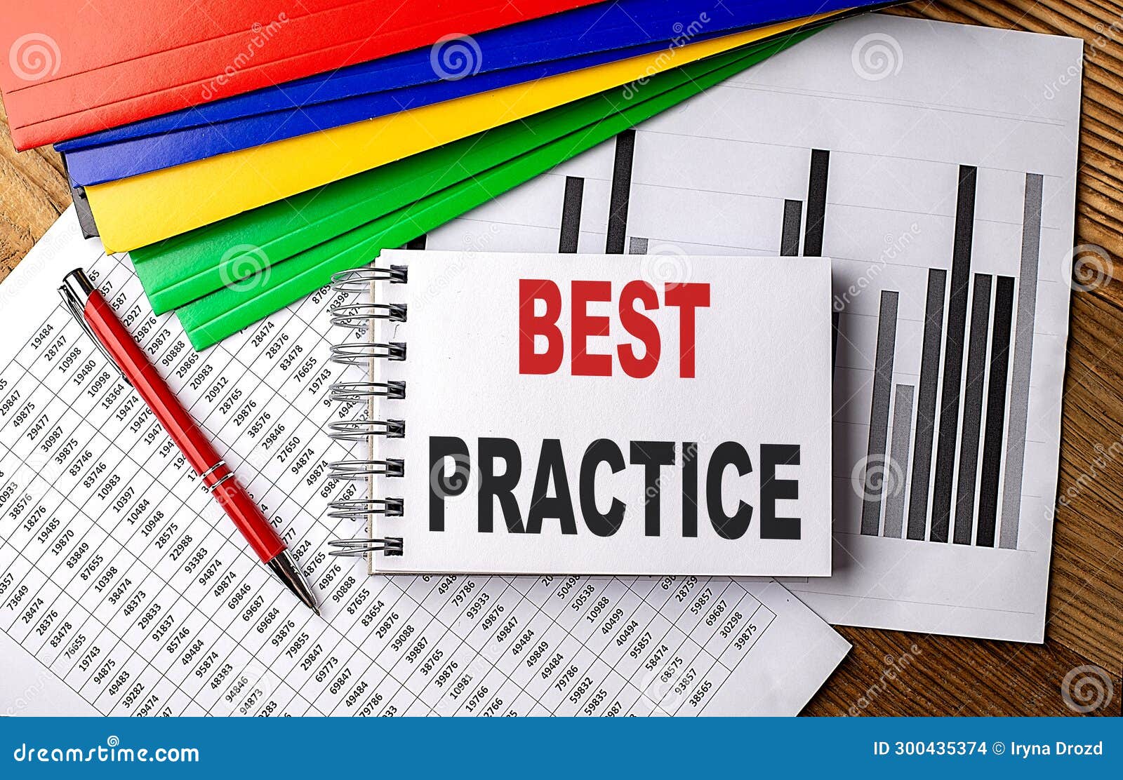 BEST PRACTICE Text on a Notebook with Pen, Folder on a Chart Background ...