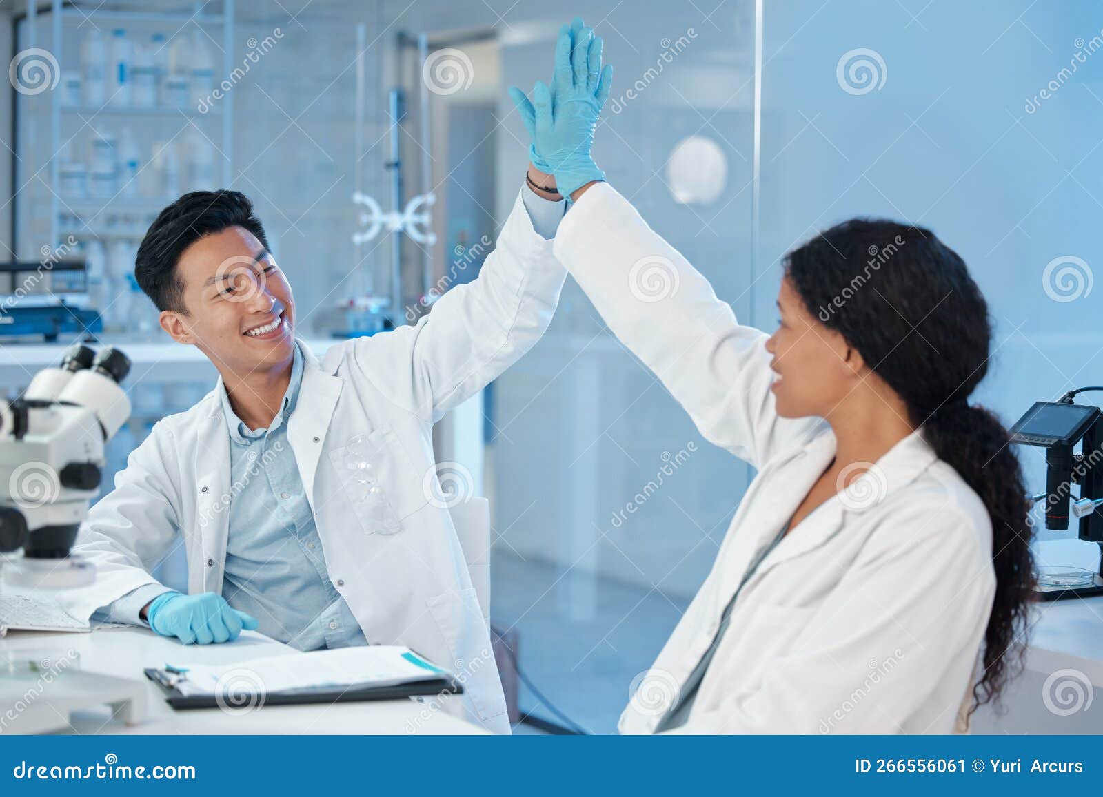 The Best of the Best. Two Lab Technicians High Fiving One Another ...