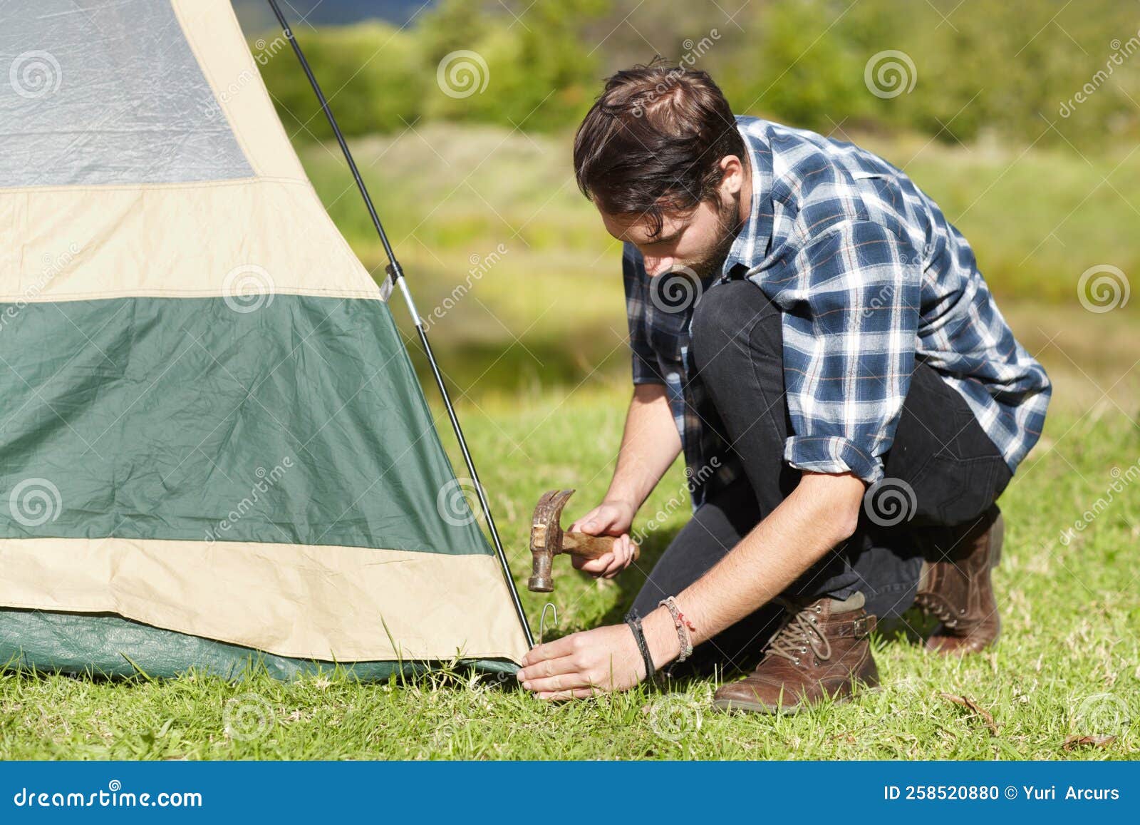 Better Make Sure Its Securely Fastened. Handsome Young Man Hammering a ...