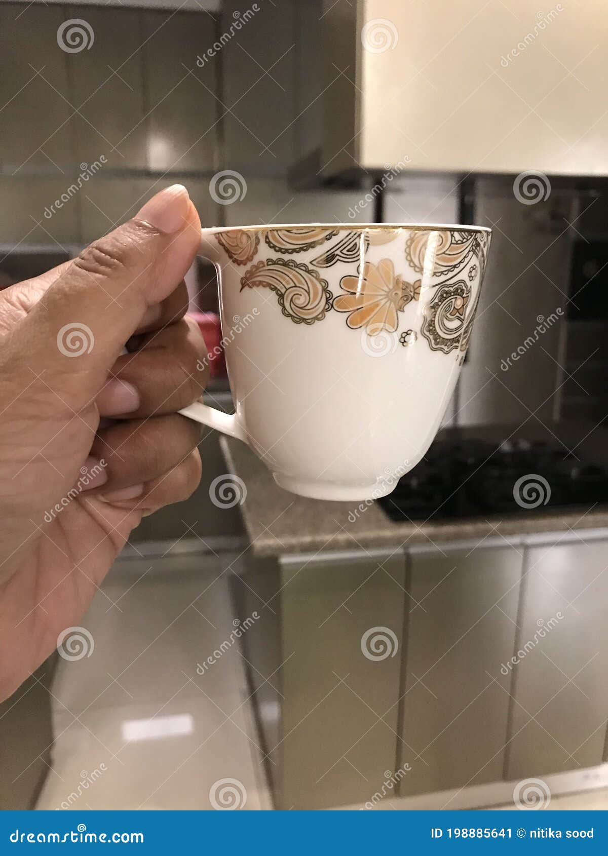 A beutiful tea cup on hand stock image. Image of baby - 198885641