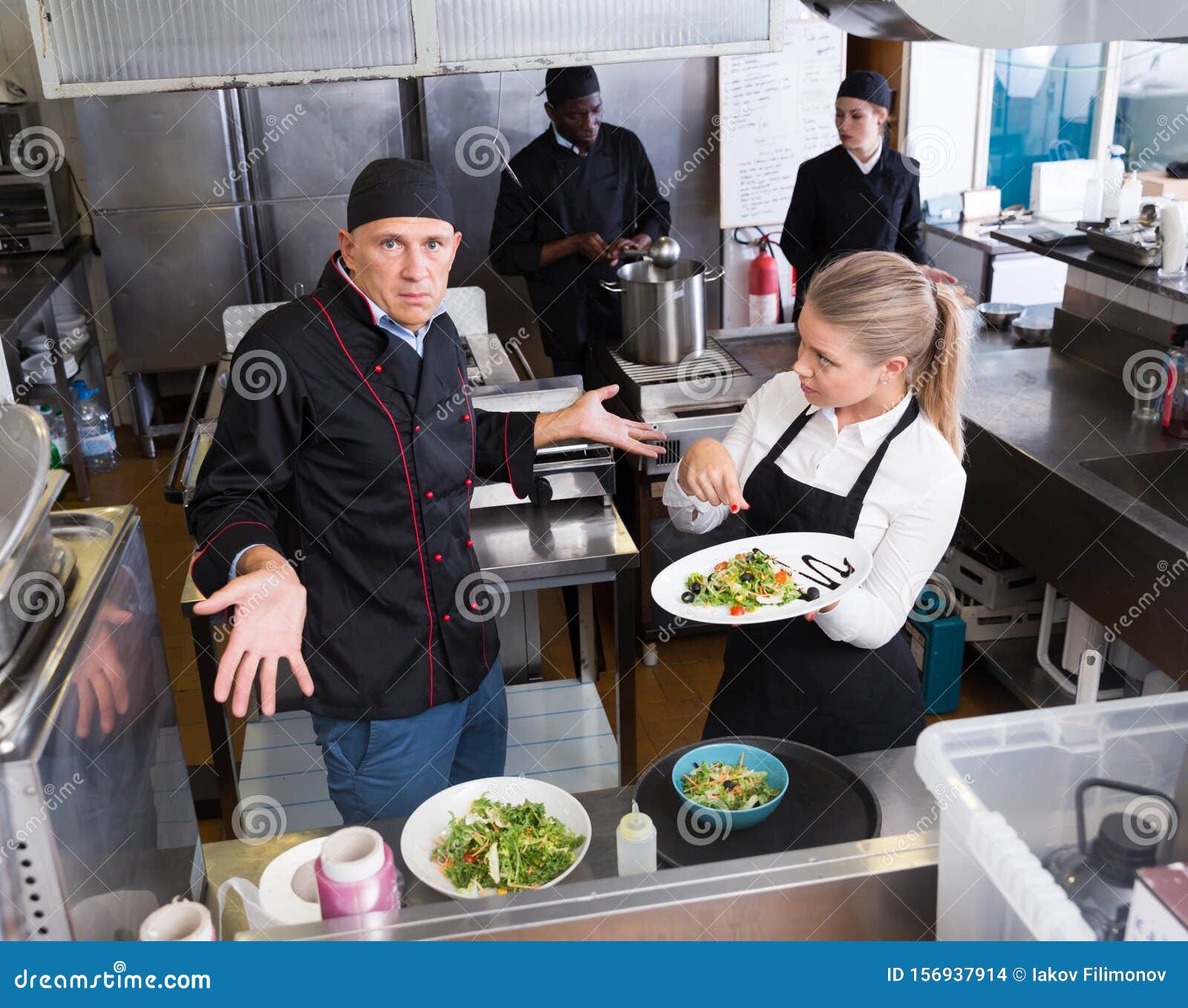Bewildered Chef Talking with Waitress Stock Photo - Image of girl ...