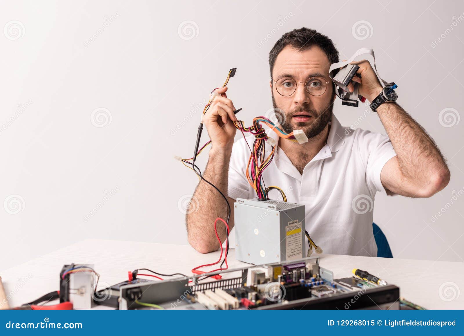 Bewildered Man Holding Wires and Computer Parts in Hands Stock Image ...