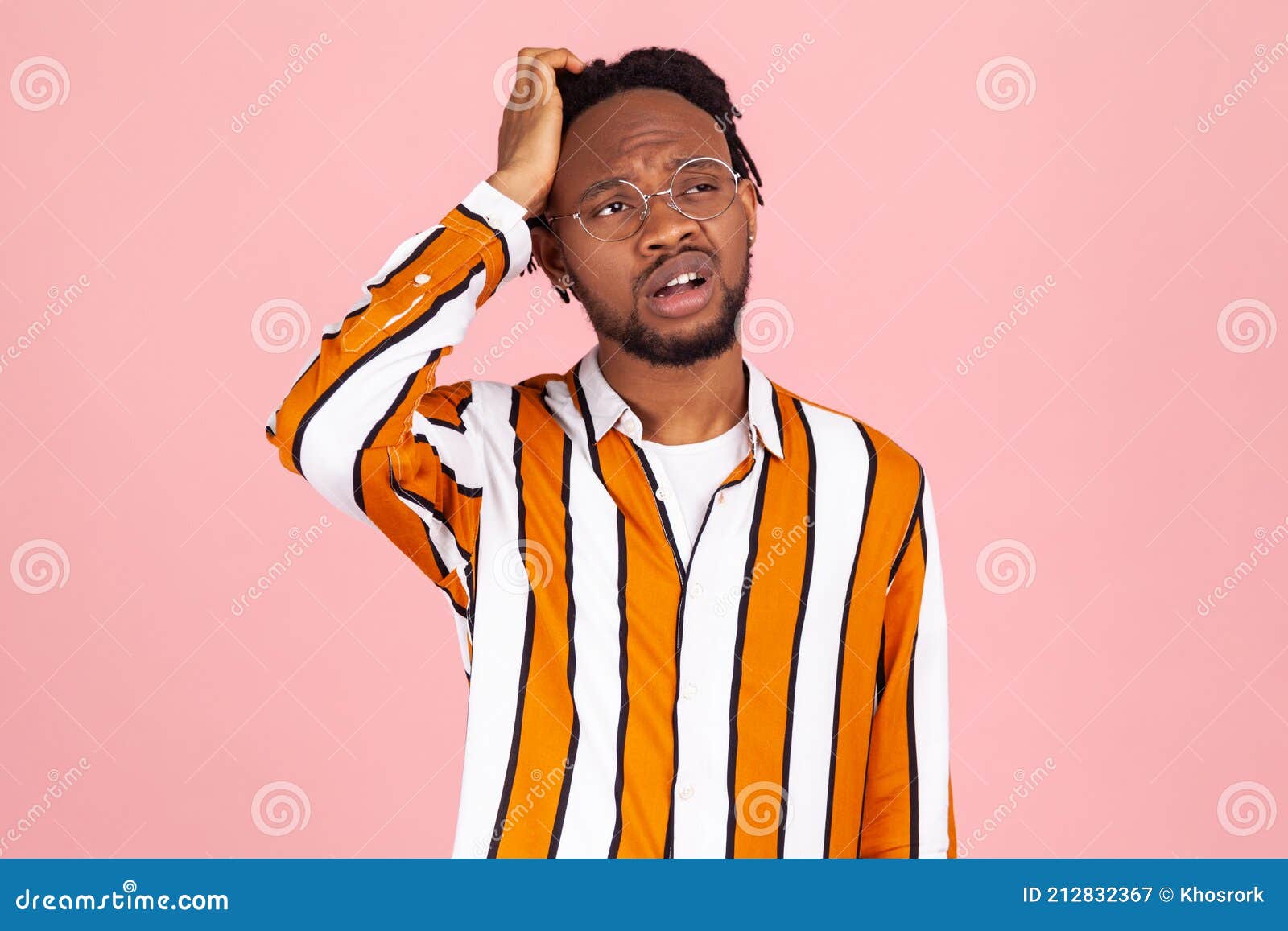 Bewildered Perplexed Afro American Man With Dreadlocks In Striped