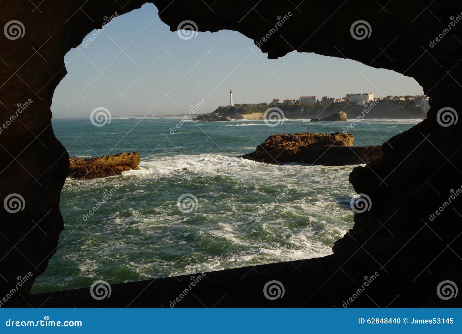 Biarritz Lighthouse through Hole in Rock Stock Photo - Image of ...