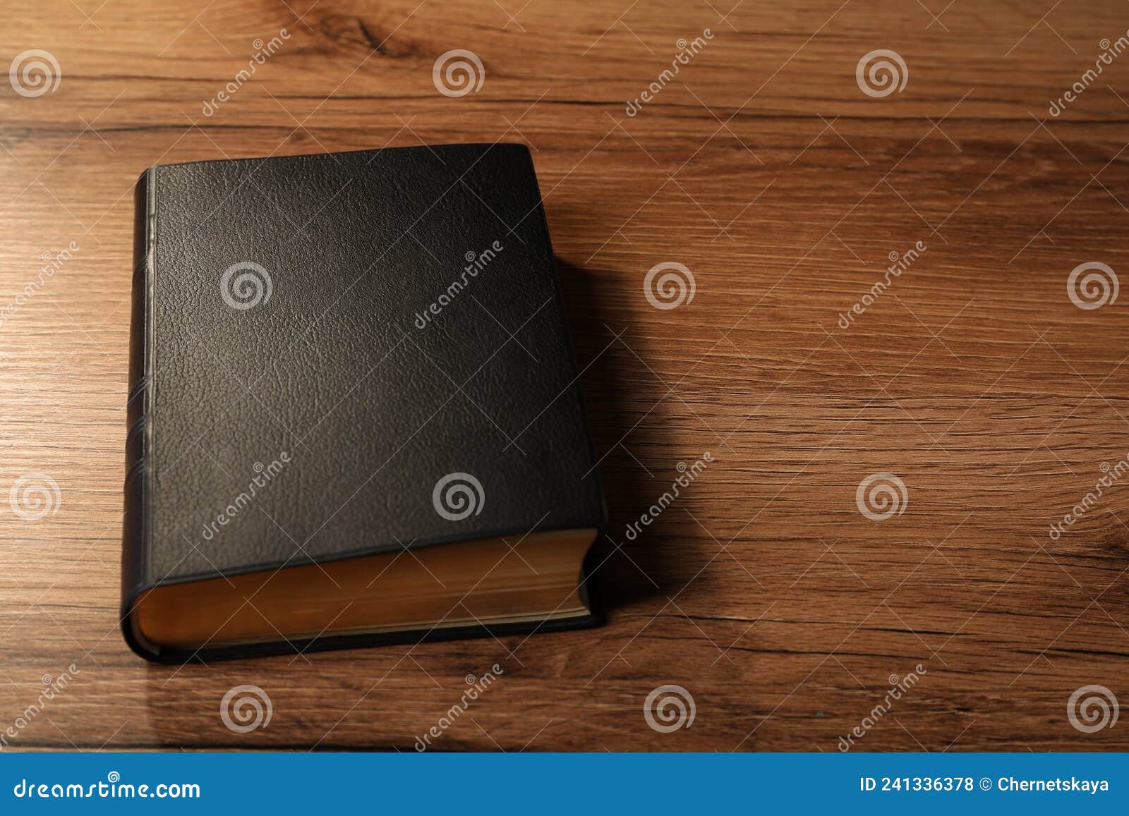 Bible with Black Cover on Wooden Table. Space for Text Stock Photo ...