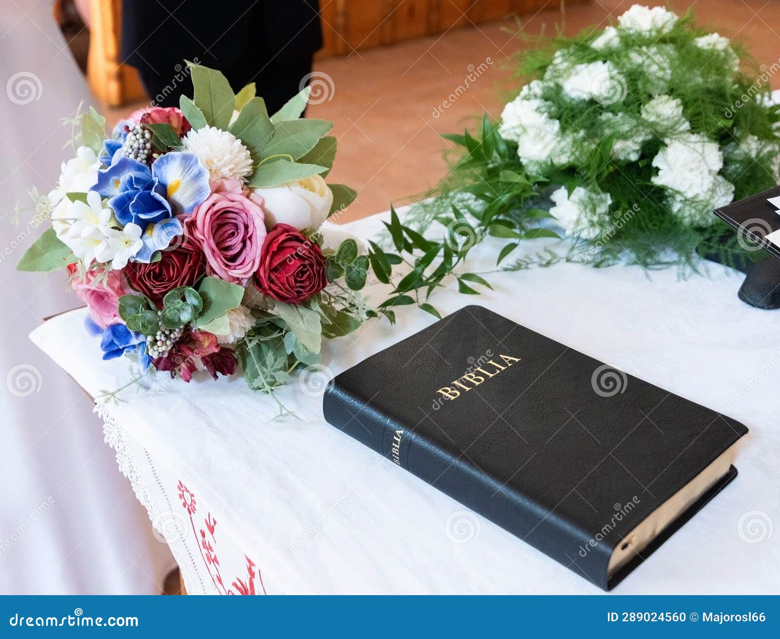 Bible Book on the Table Next Two Bouquet of Flowers at a Wedding Stock ...