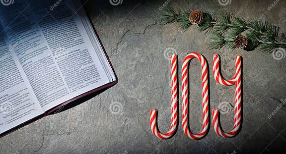 Bible and Joy Written with Candy Canes on Stone Table Stock Photo ...