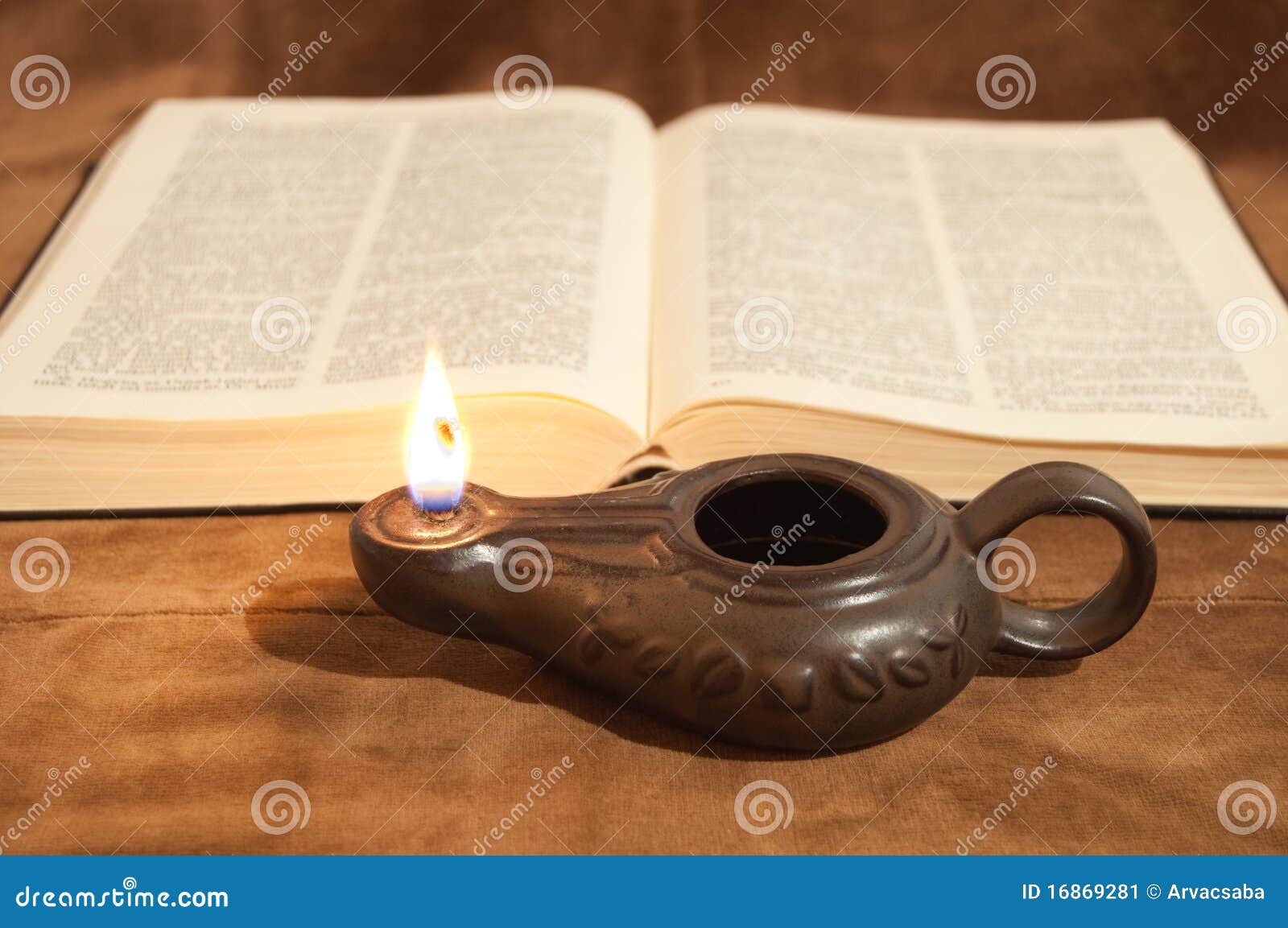 Bible and Oil Lamp stock image. Image of close, text - 16869281