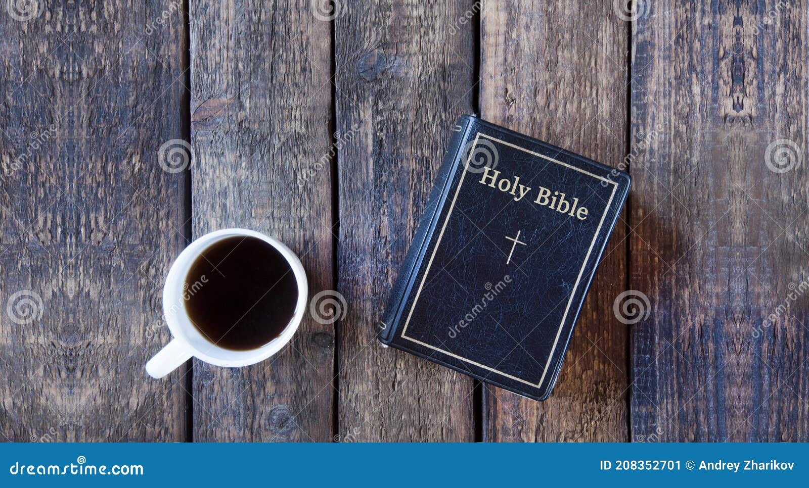 Bible on the Table. Holy Book. a Cup on a Wooden Table. Stock Image ...