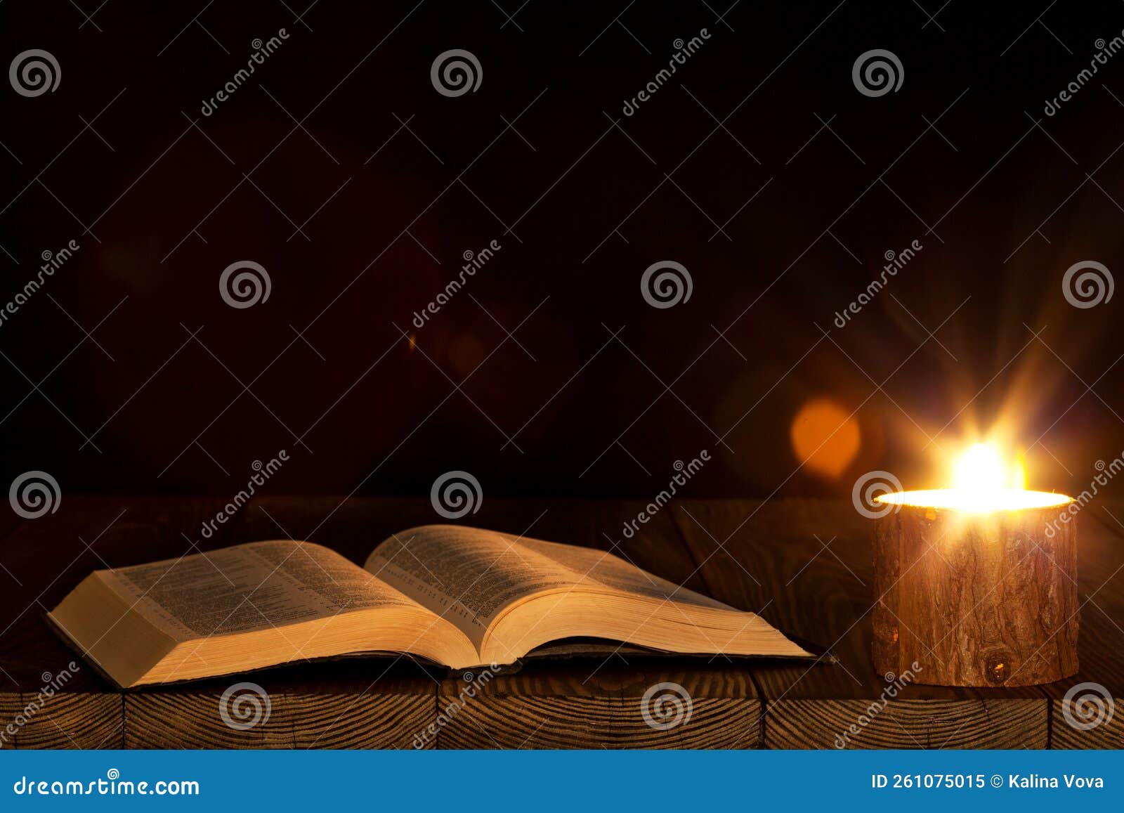 A Bible on the Table in the Light of a Candle Stock Image - Image of ...