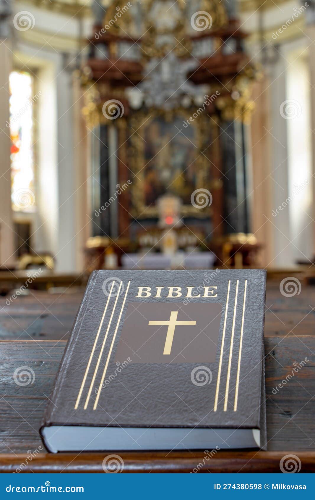 The Bible on the Table of a Prayer Bench in the Church with a Altar ...