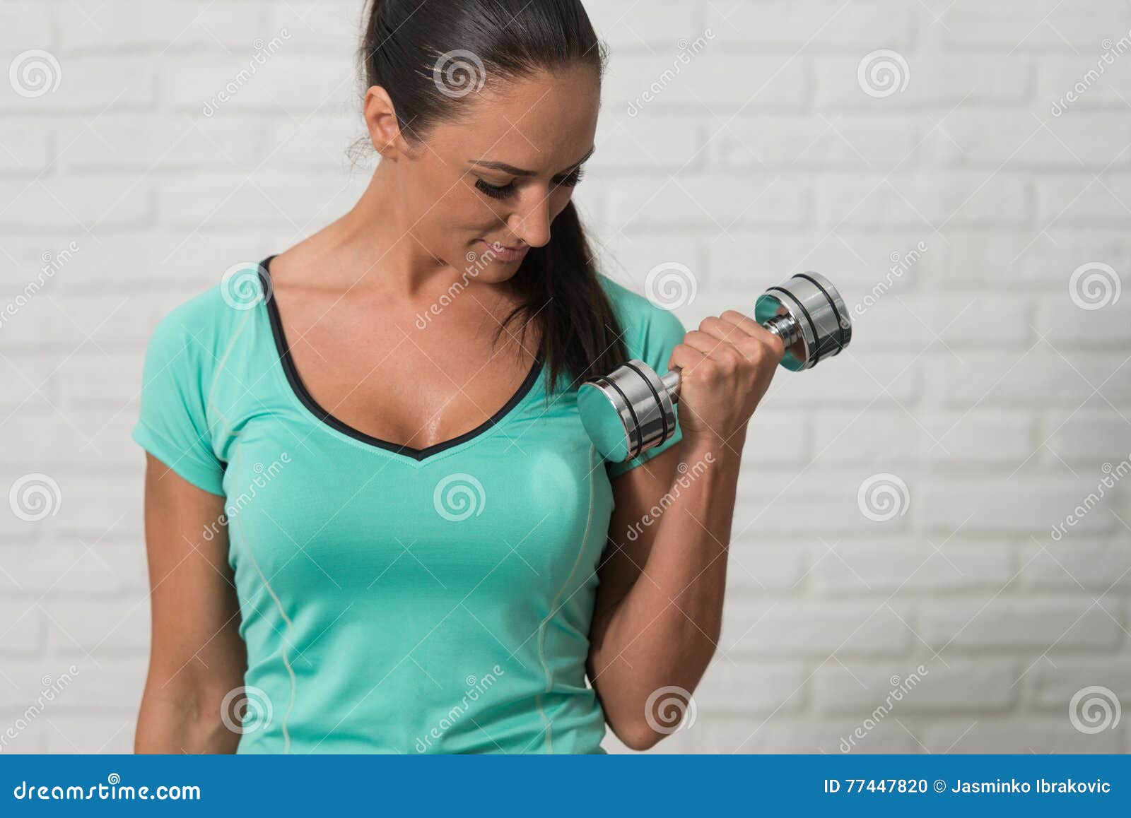 Biceps Exercise with Dumbbells on White Bricks Background Stock Photo ...