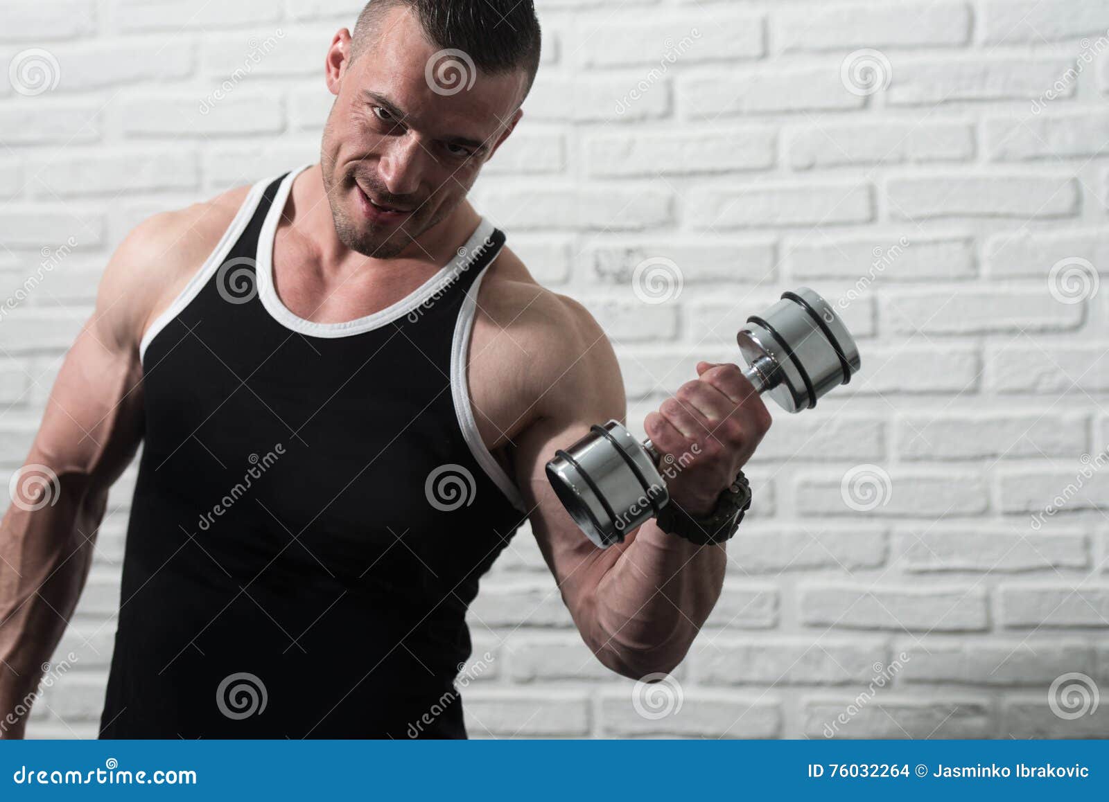 Biceps Exercise with Dumbbells on White Bricks Background Stock Photo ...