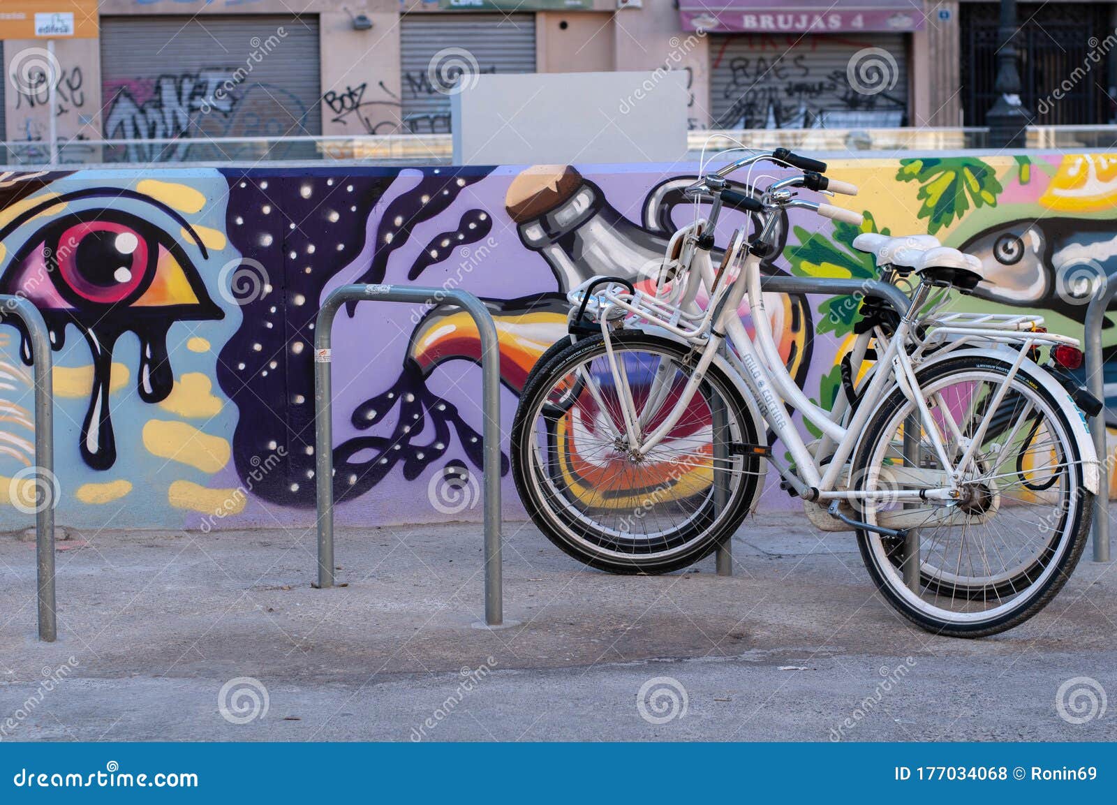 Bicycle on the Background of a Wall with Graffiti Editorial Stock Photo ...