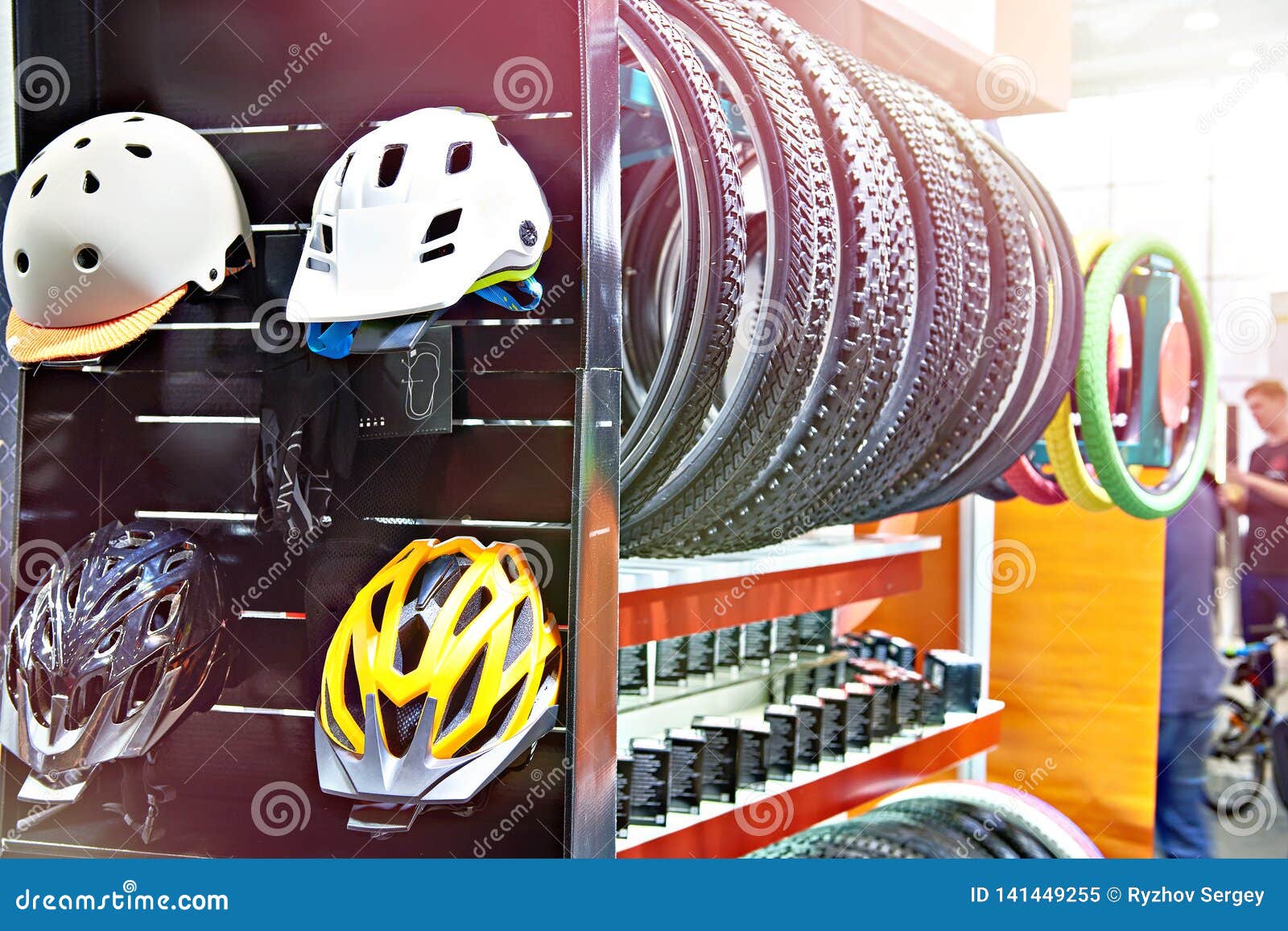 Bicycle Helmets and Tires in Store Stock Image - Image of sale, pattern ...