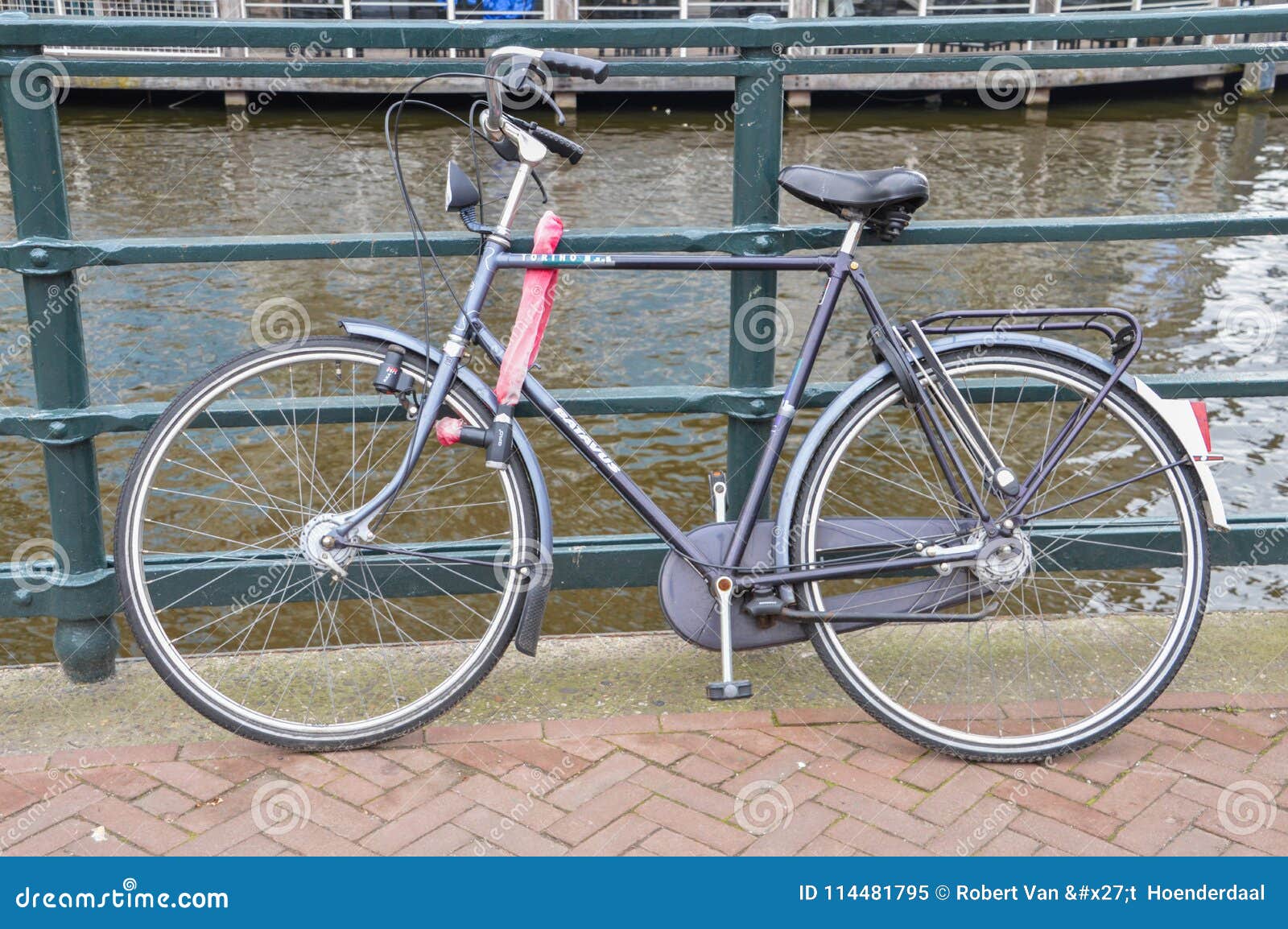 Bicycle Locked at a Gate at Amsterdam the Netherlands Editorial Image ...