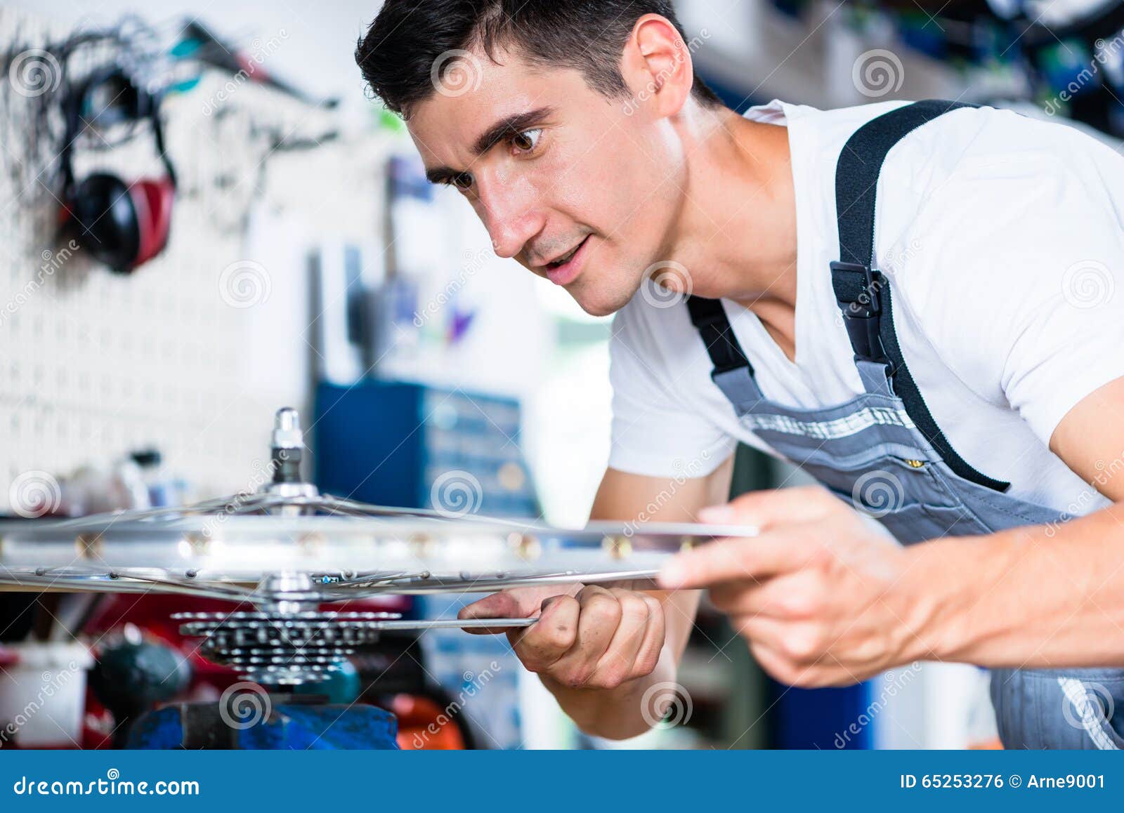 Bicycle Mechanic Working in His Bike Workshop Stock Photo - Image of ...