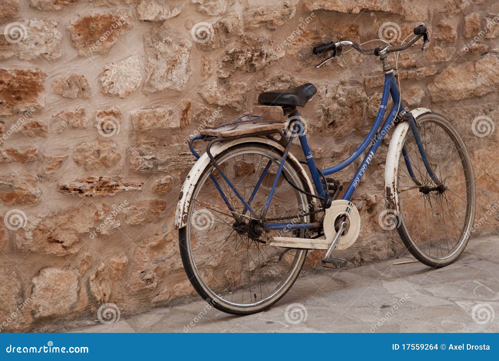 Bicycle near stone wall. stock photo. Image of wheeled - 17559264