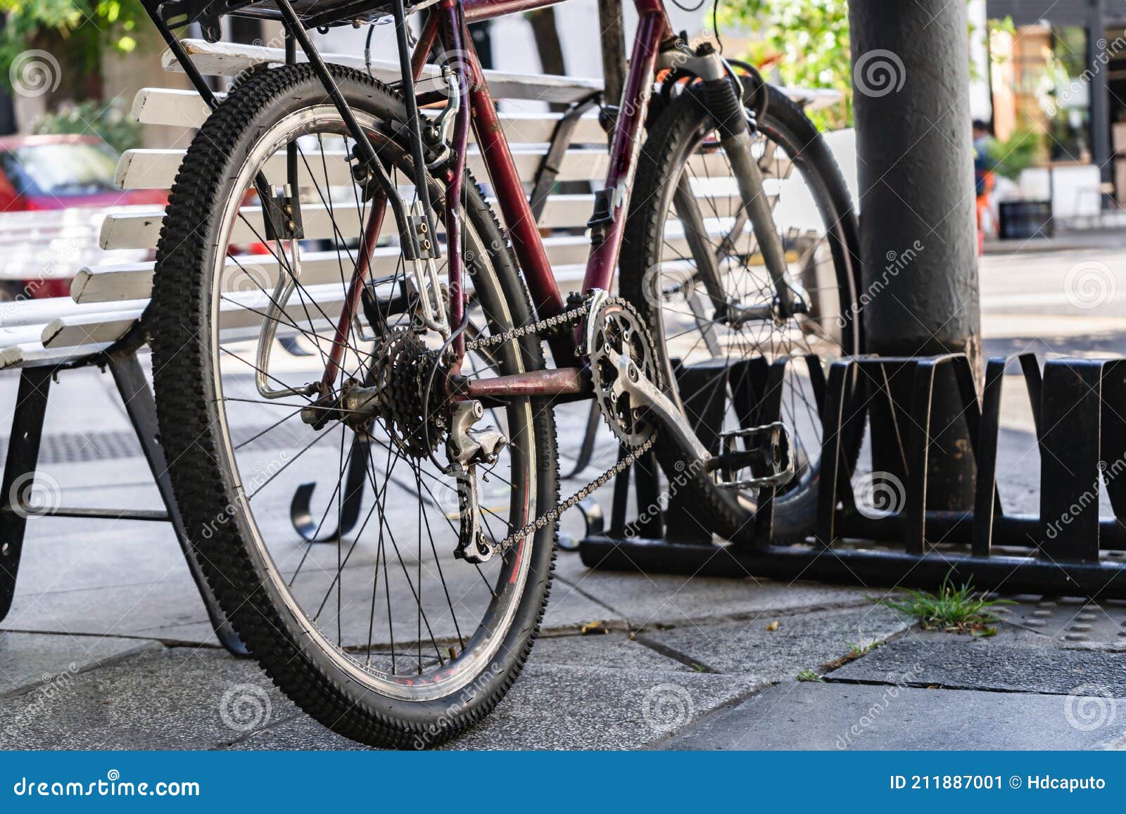 Bicycle Parked in a Bicycle Rack in a Corner of the Sidewalk Stock ...