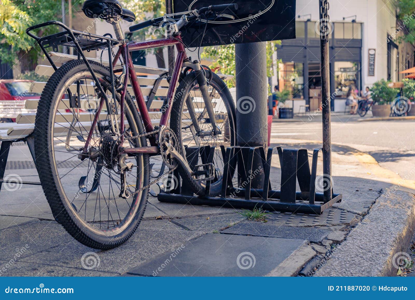 Bicycle Parked in a Bicycle Rack in a Corner of the Sidewalk Stock ...