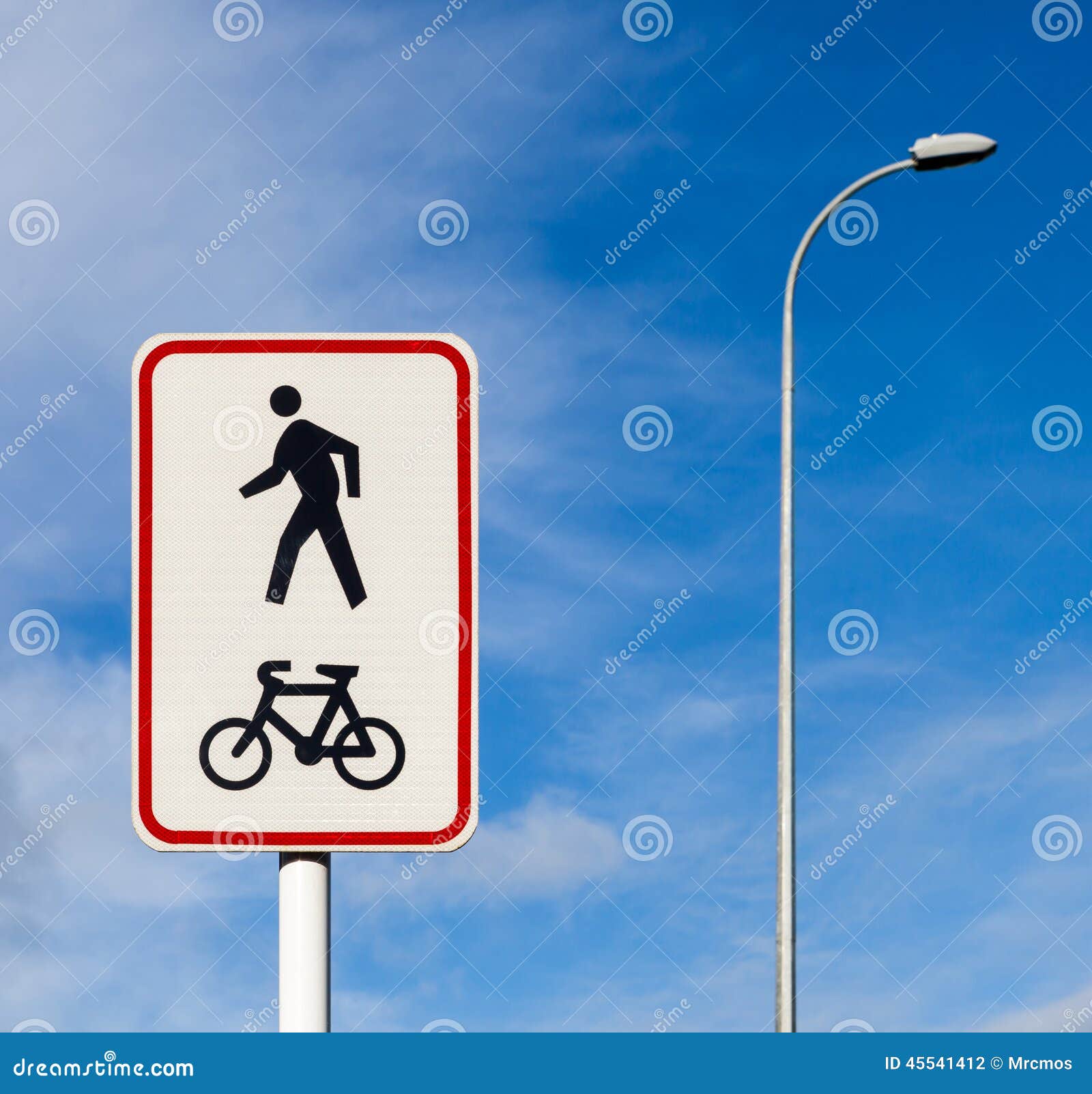 Bicycle and Pedestrian Shared Route Sign on Pole Post Against Bl Stock ...