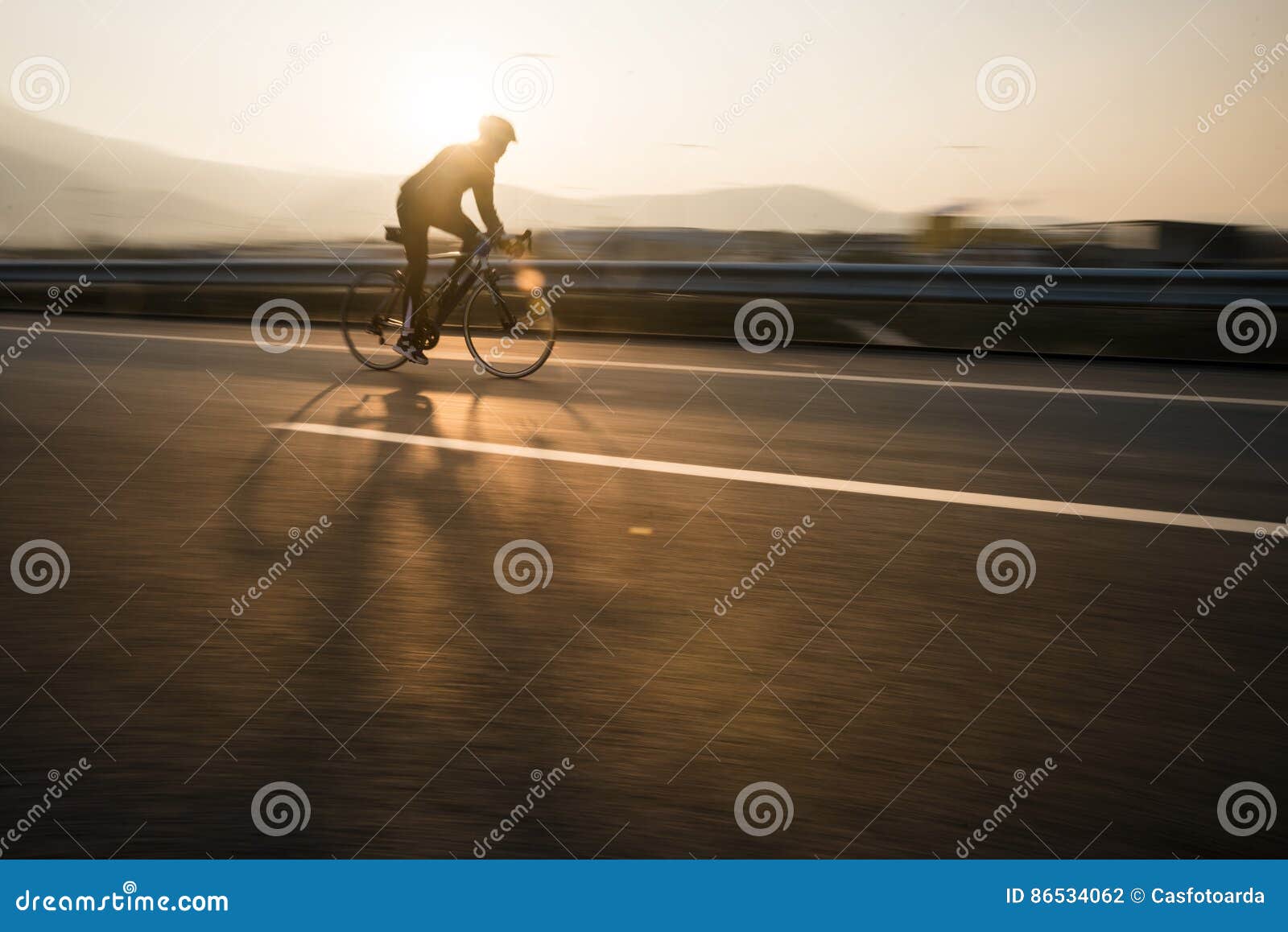 Bicycle rider rides fast. stock photo. Image of race - 86534062