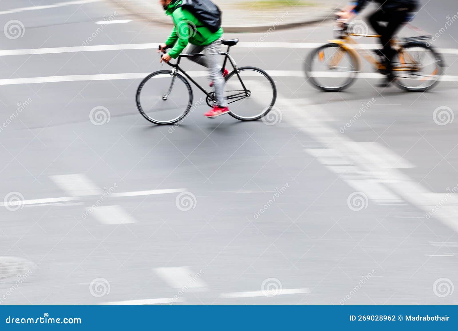 Bicycle Riders Crossing an Intersection Stock Photo - Image of road ...